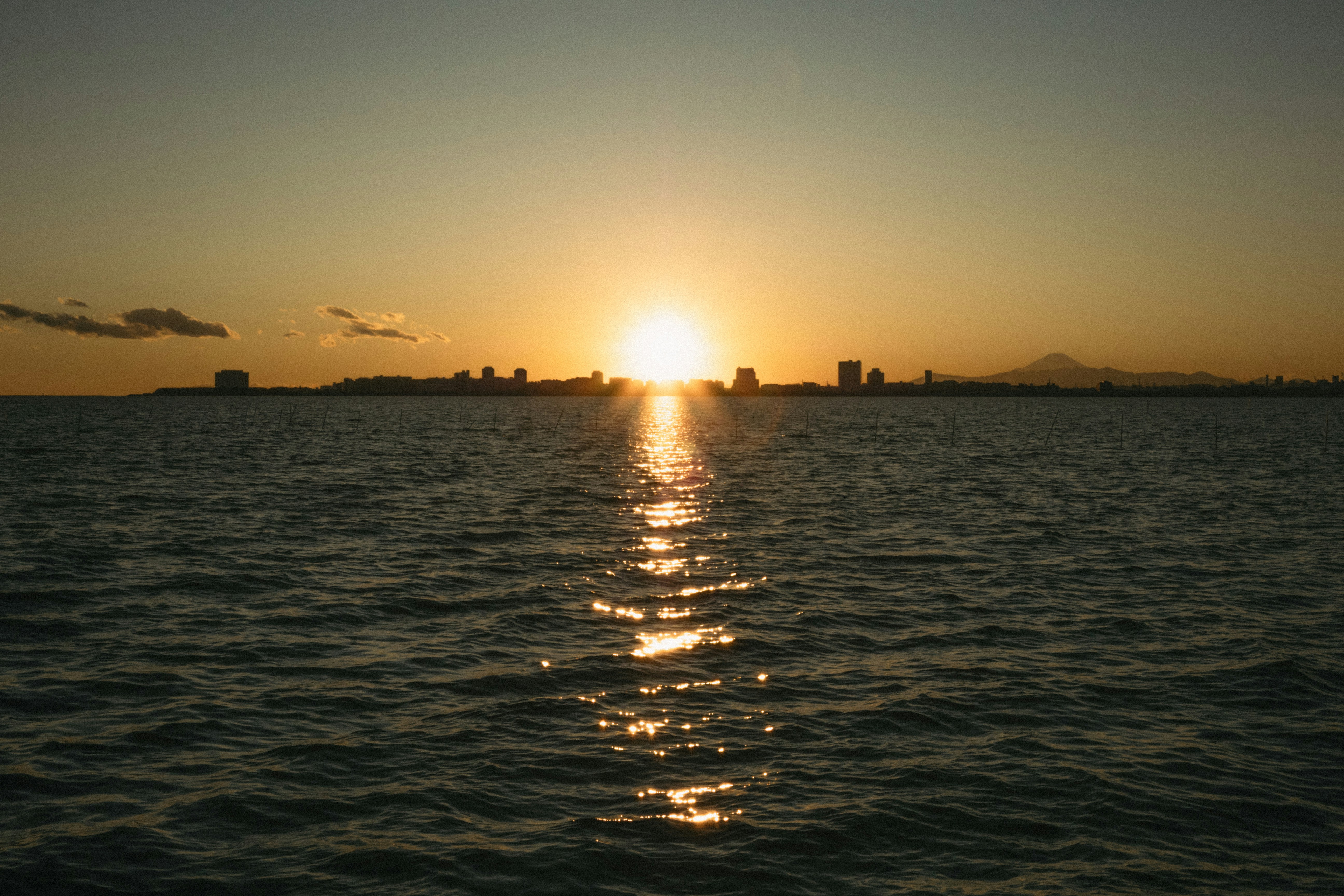 Sunrise Over a Quiet Harbor Horizon