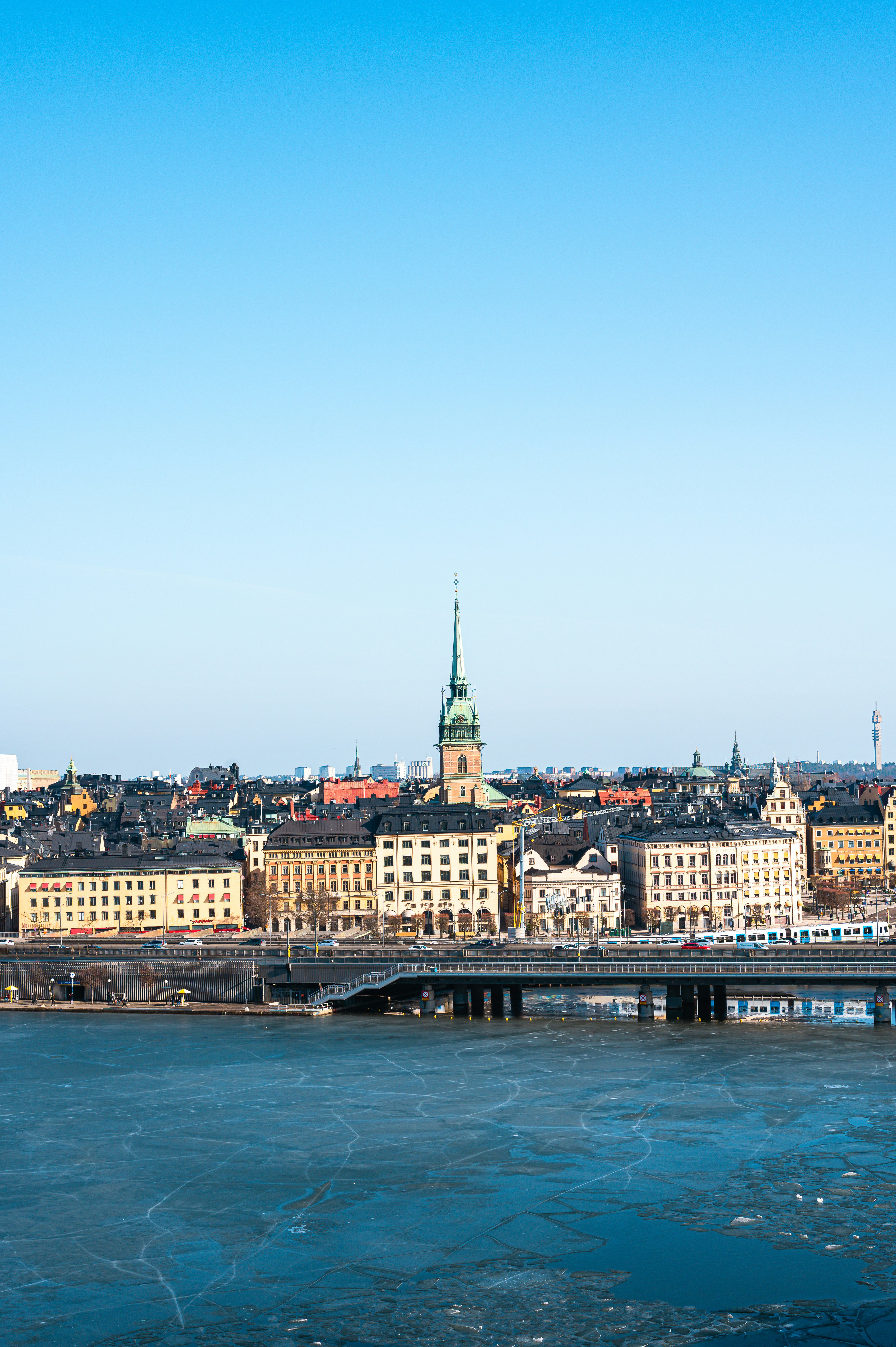 Spire Over the Waterfront: A Nordic Cityscape on a Clear Day
