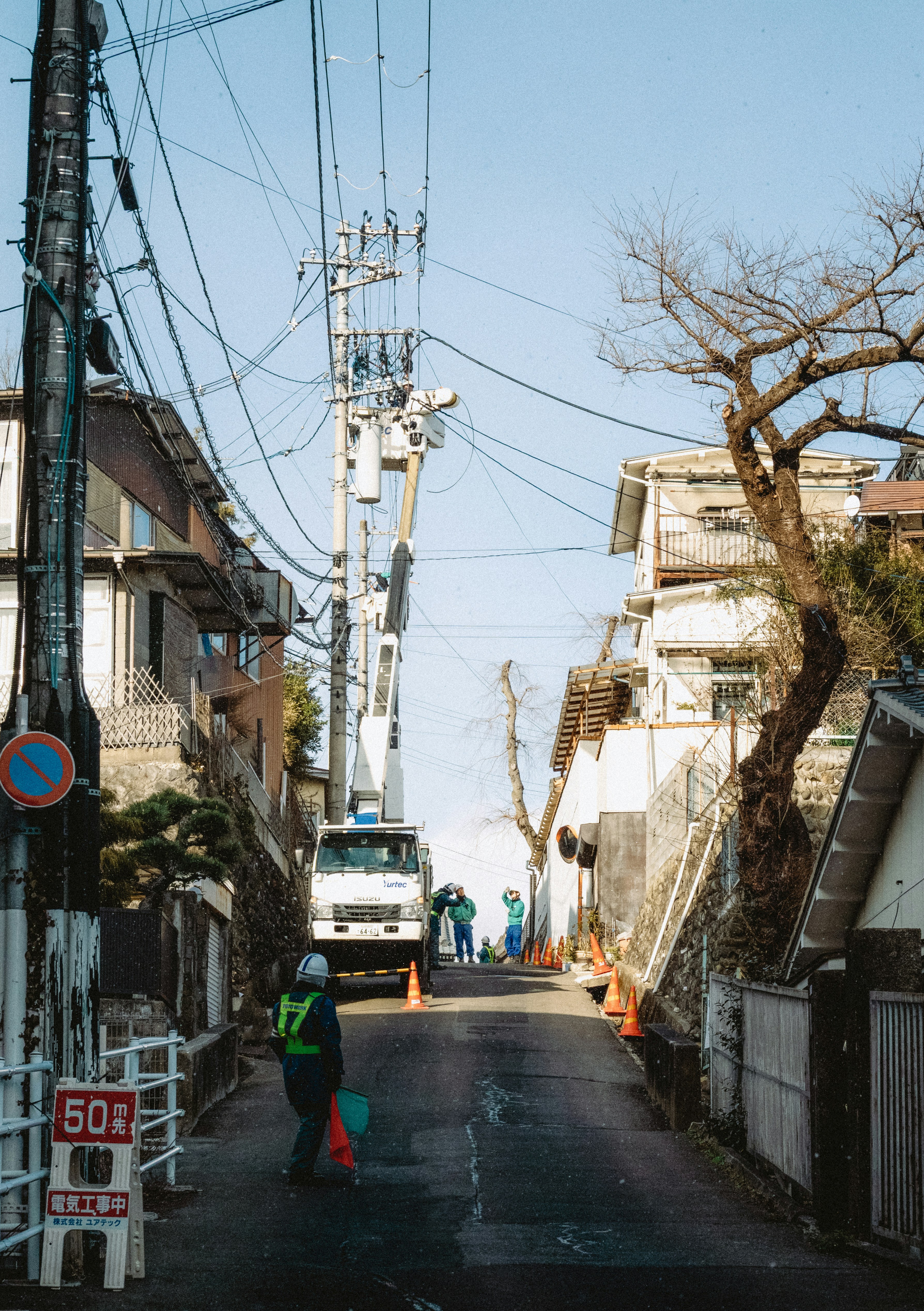 Toward the Crest: Utility Crew at a Quiet Urban Summit
