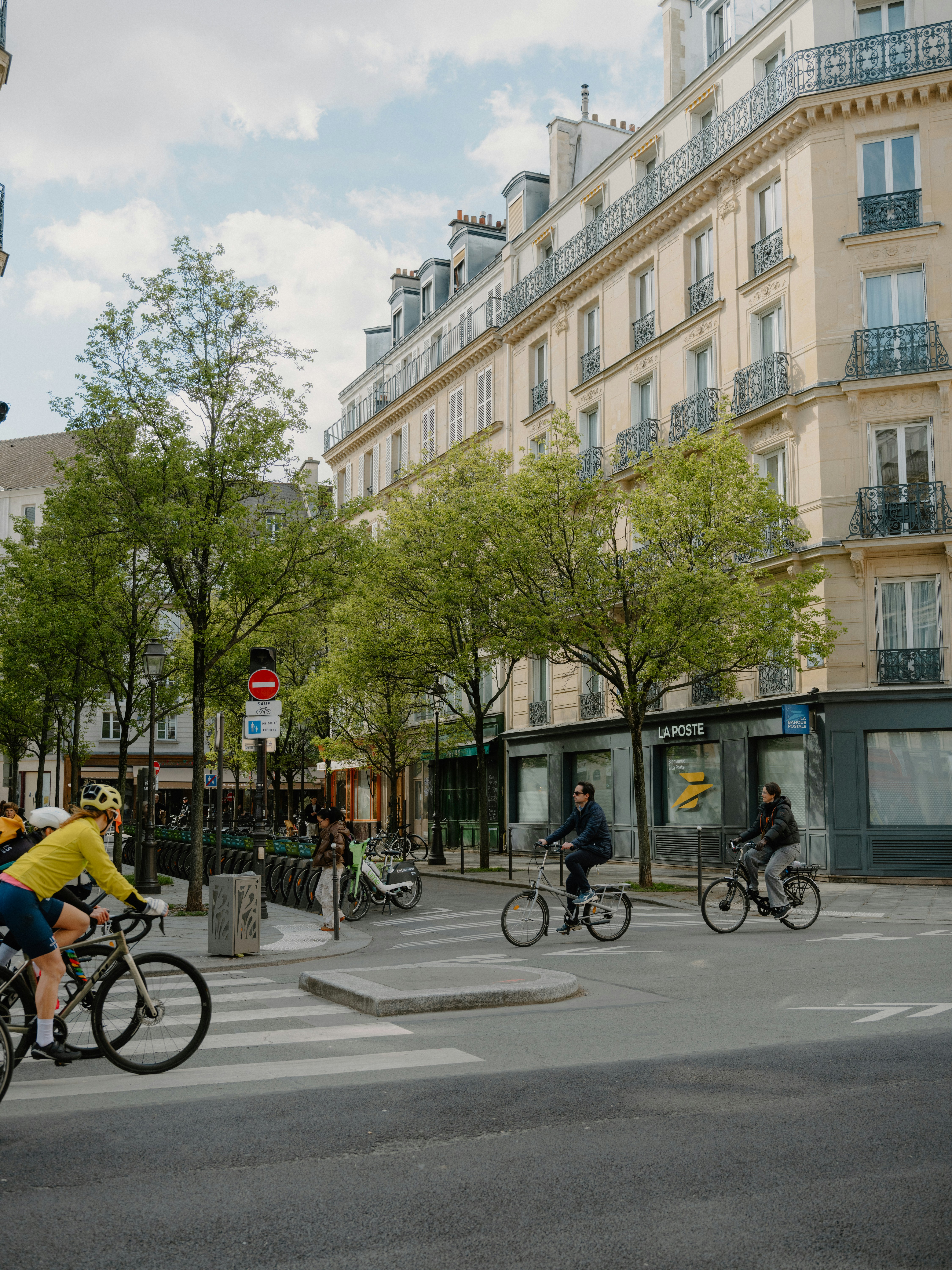 Grid of Movement: Cyclists and Parisian Facades in Morning Light