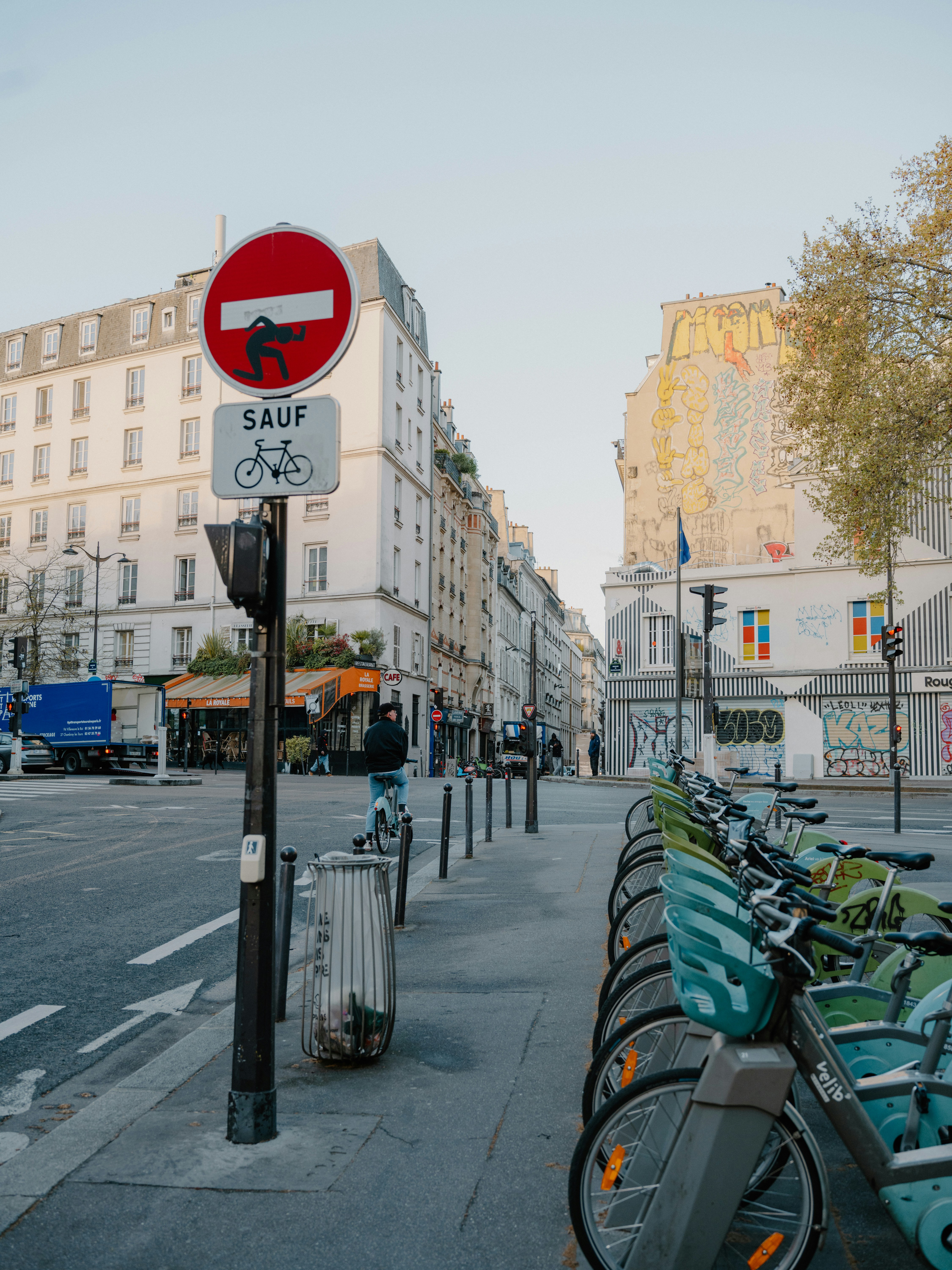 Urban Boulevard: A Quiet Street with Bicycles and Street Sign