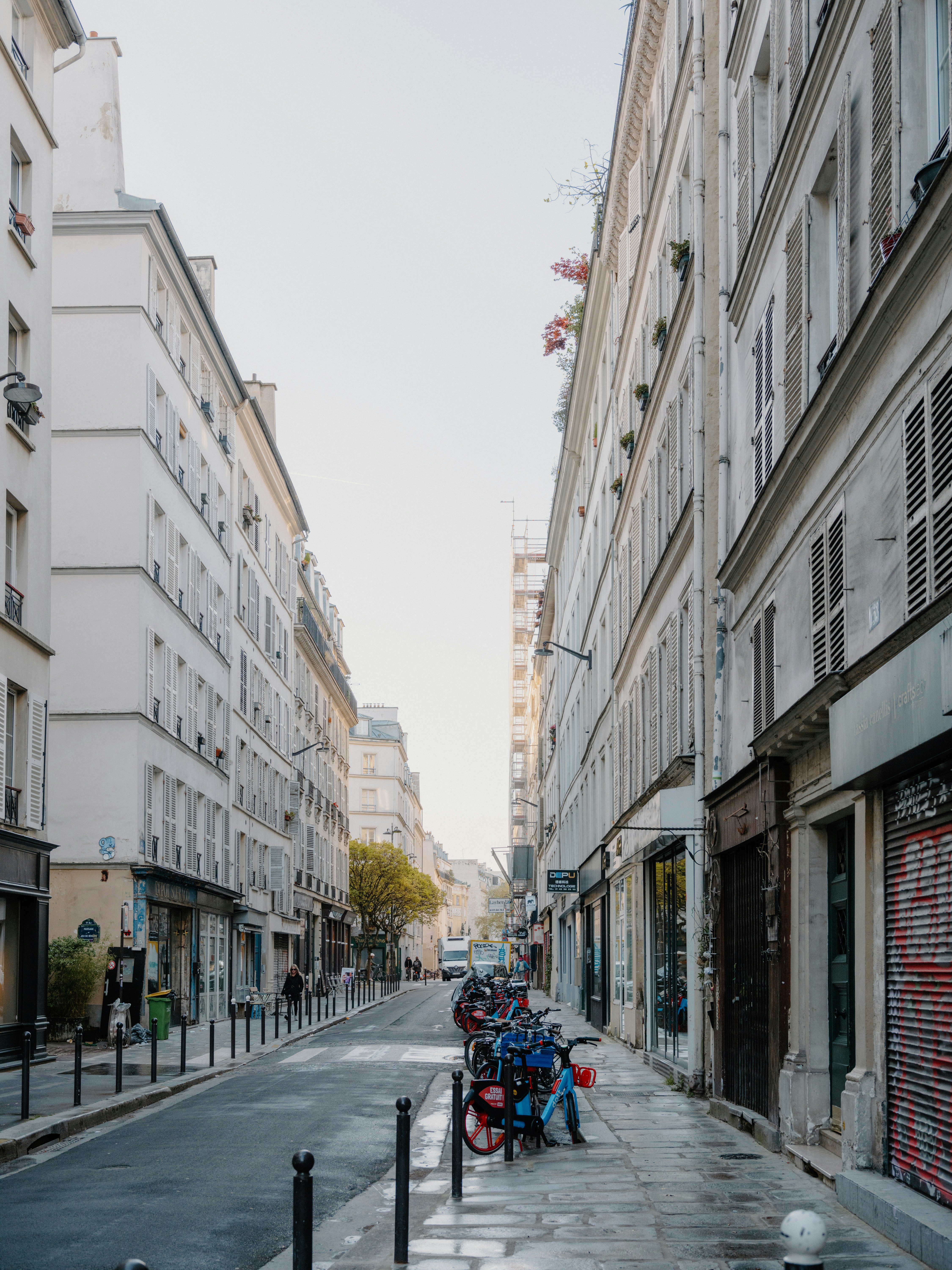 Parisian Alleyscape: Bikes and Morning Light Down a Quiet Street