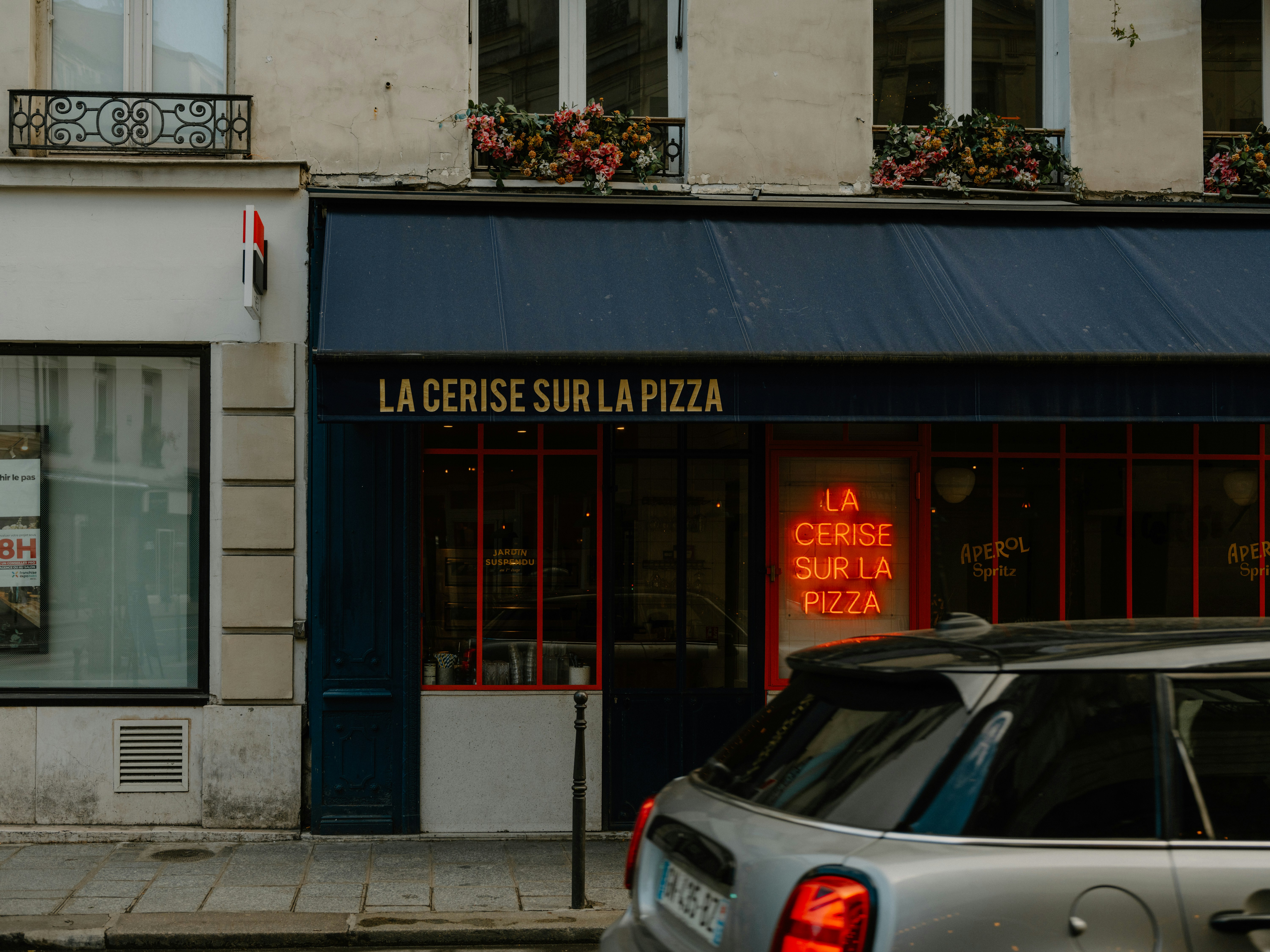 Neon Sign on a French Streetfront Afterglow