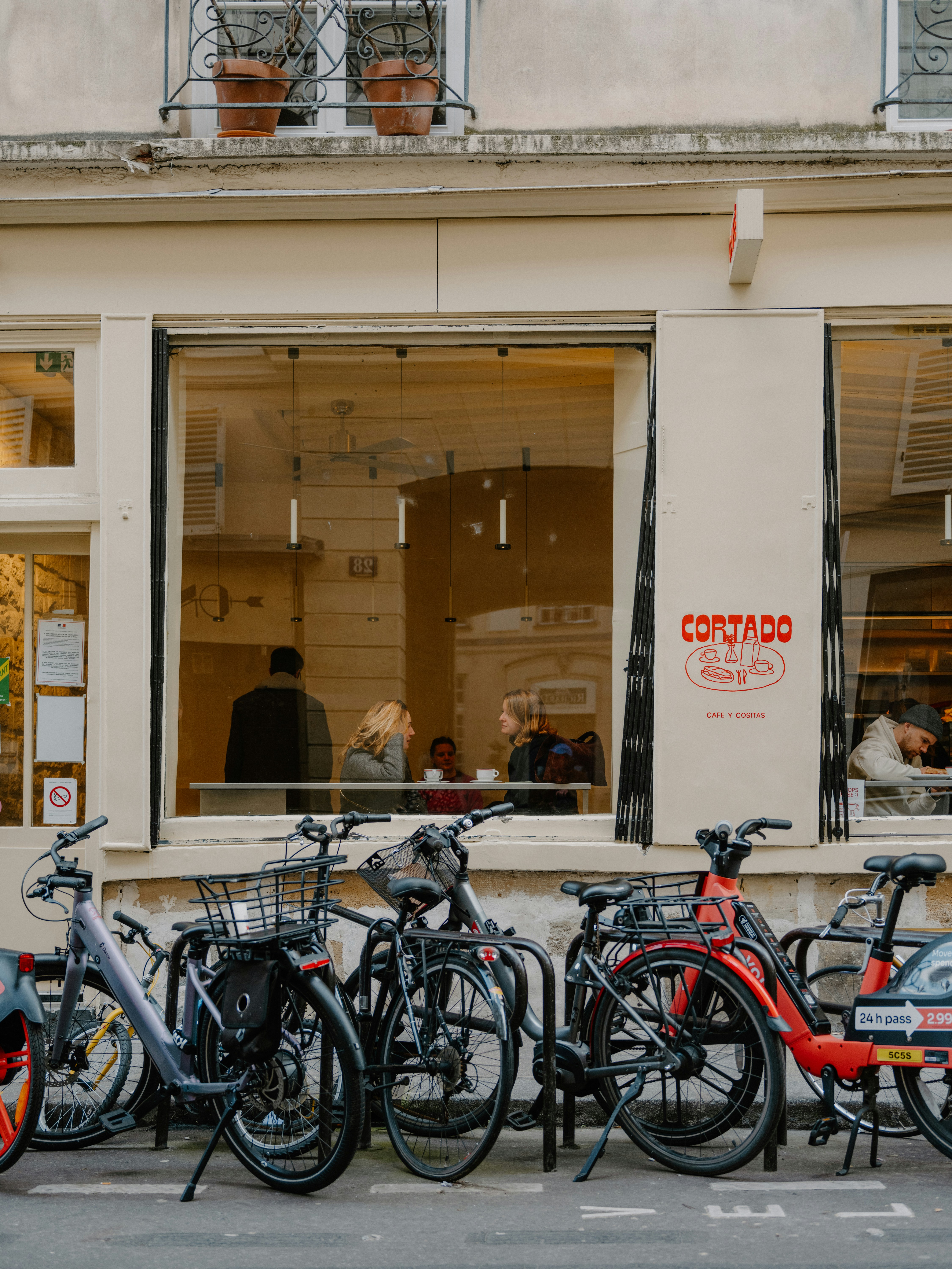 Cafe Window Reflections and Bicycles on a Quiet City Street