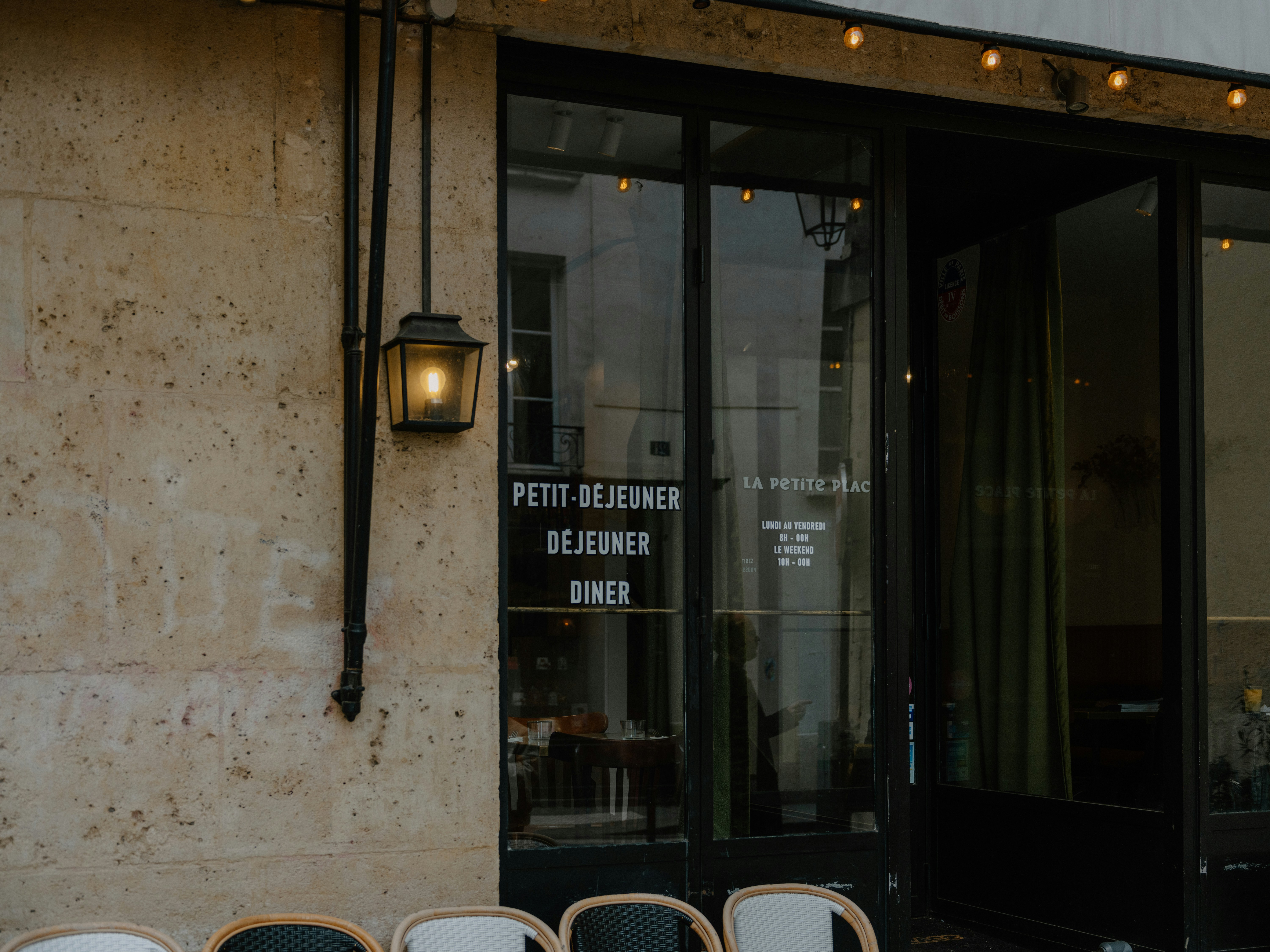 Café Frontage at Dusk: Quiet Entrance to Petit Déjeuner