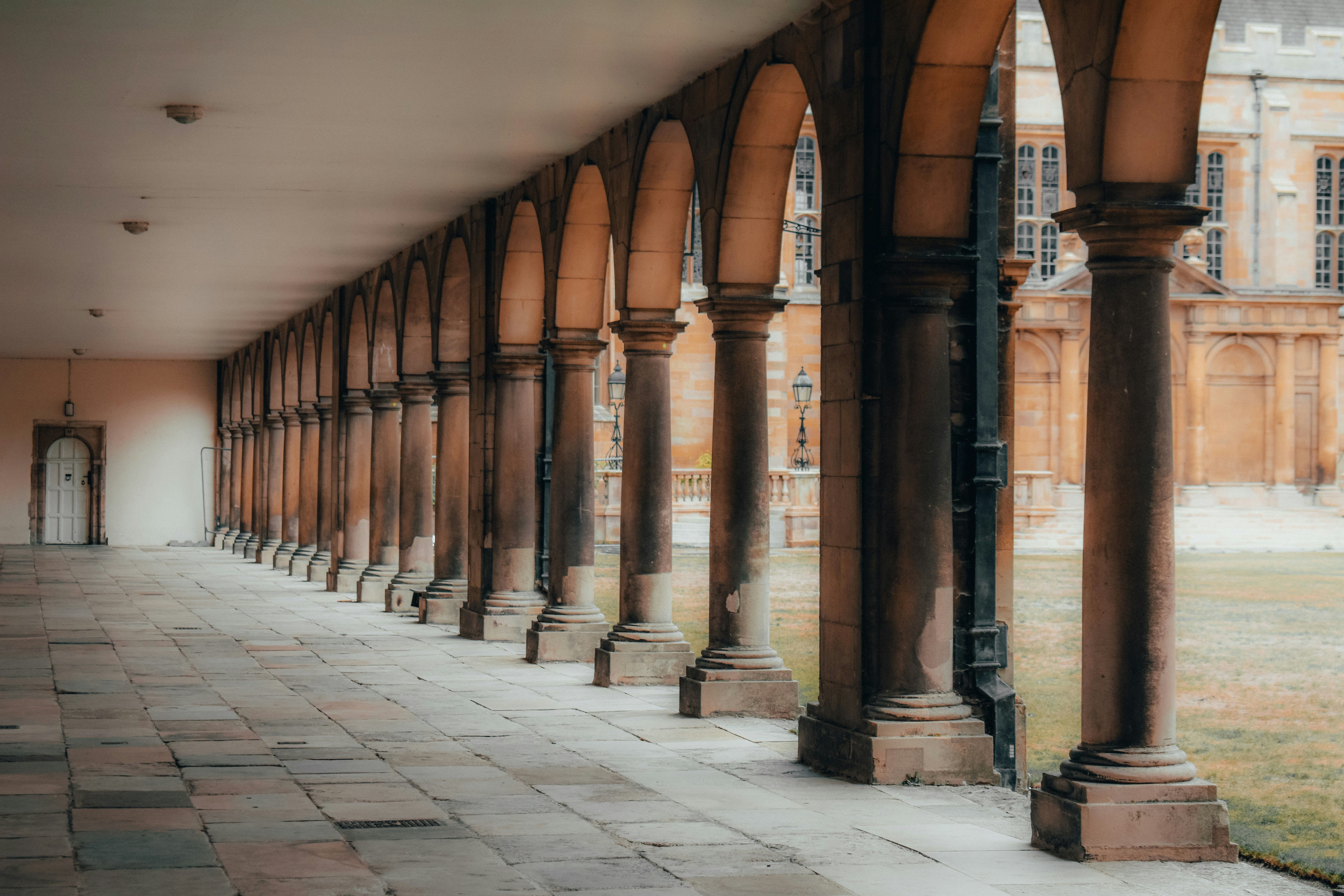 Echoes of Stone: A Corridor of Arches Receding into Light