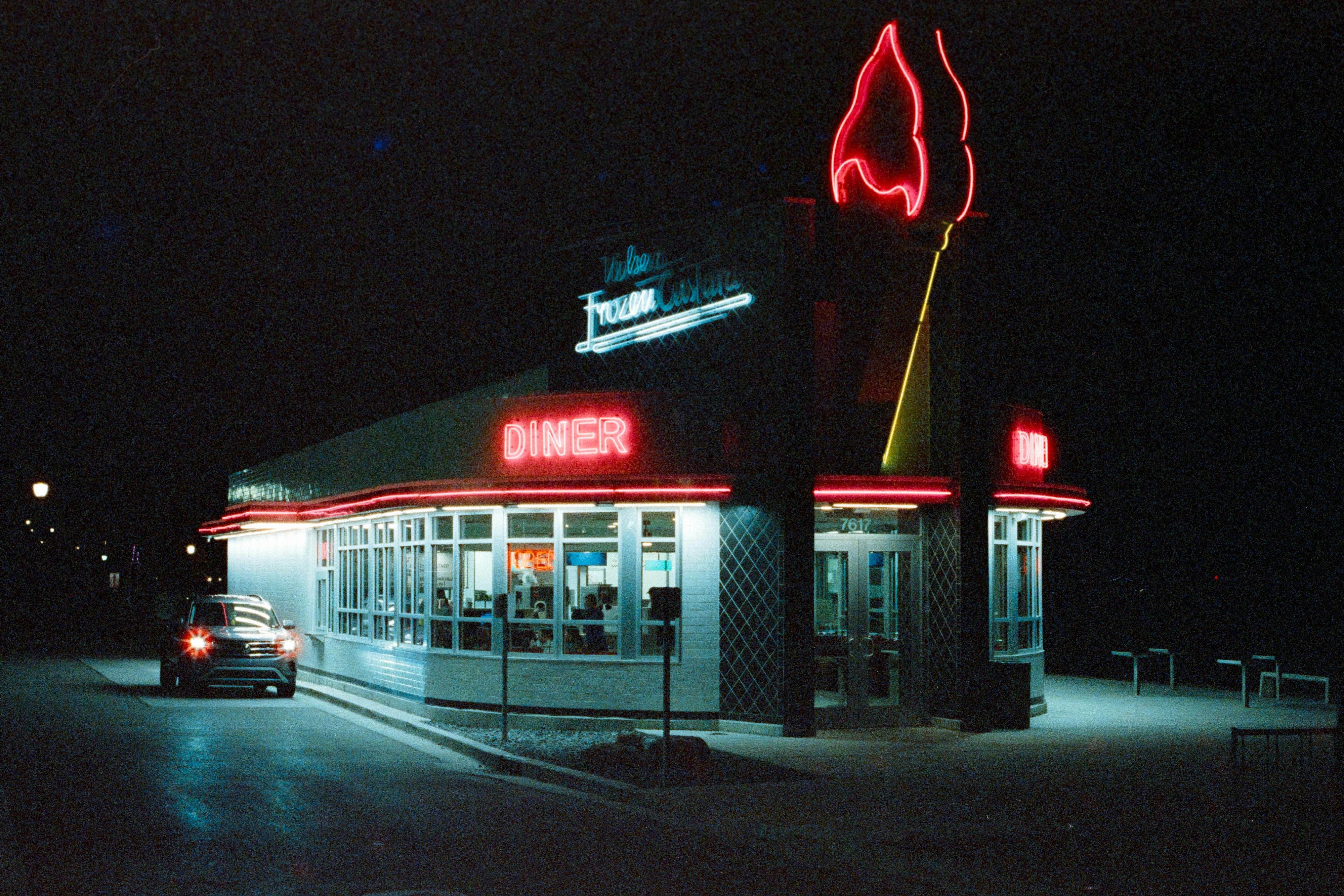 Neon Diner at Night: A Quiet Stop Under a Candleshine Sky