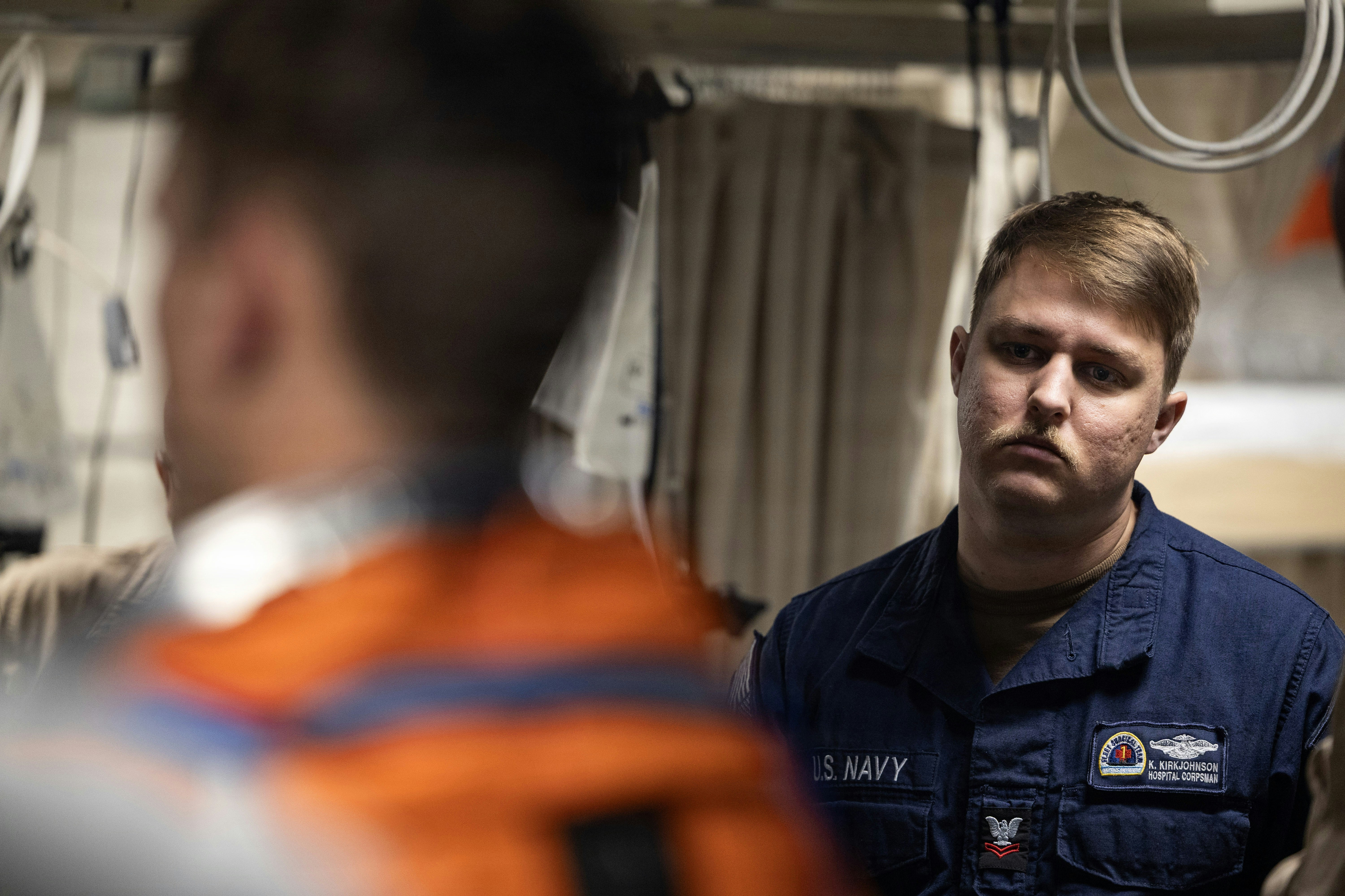Blue Navy Patch, Quiet Vigil: A Sailor in Focus