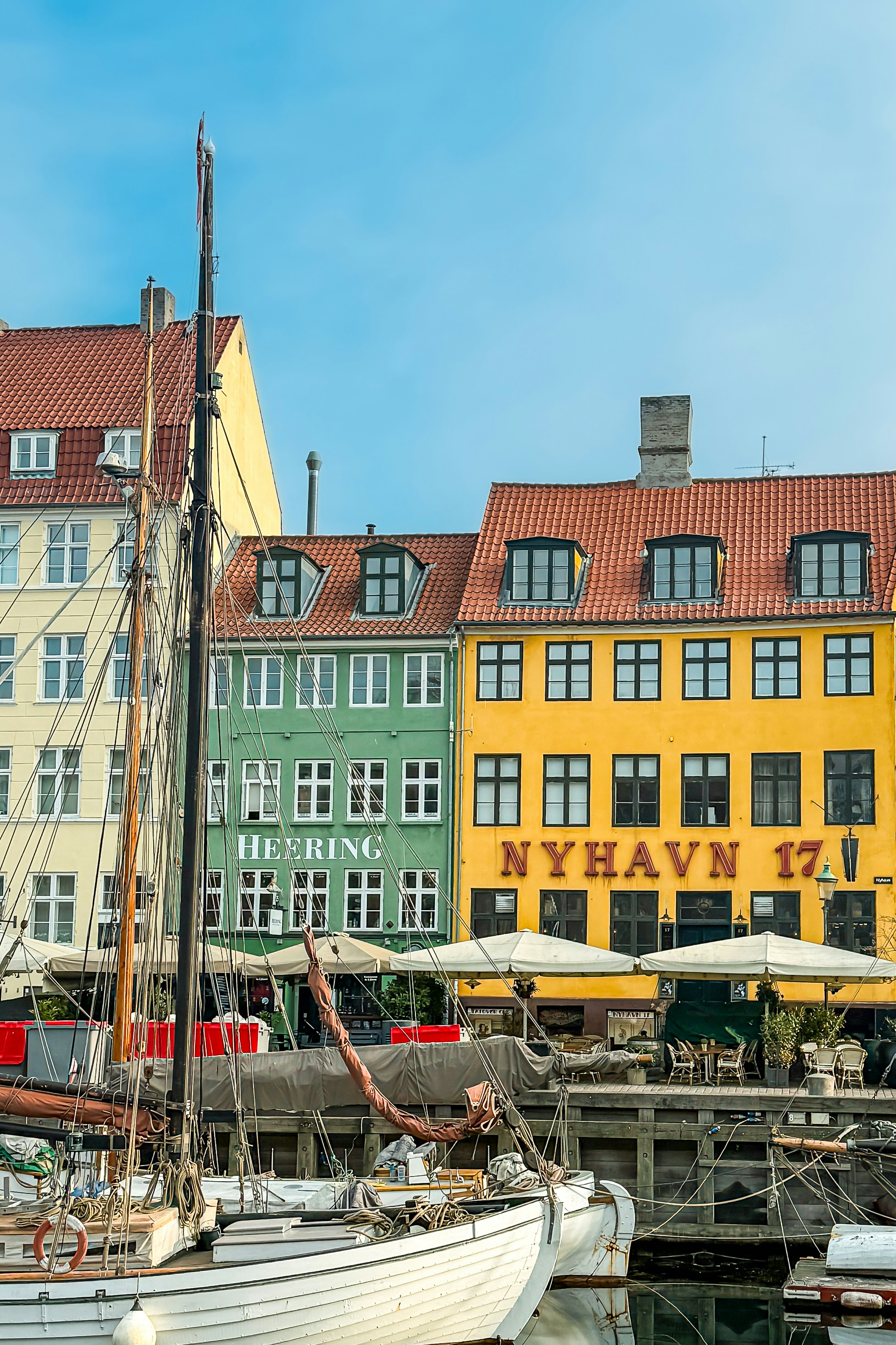 Colorful Harbor Facades Framing a Sailboat Haven