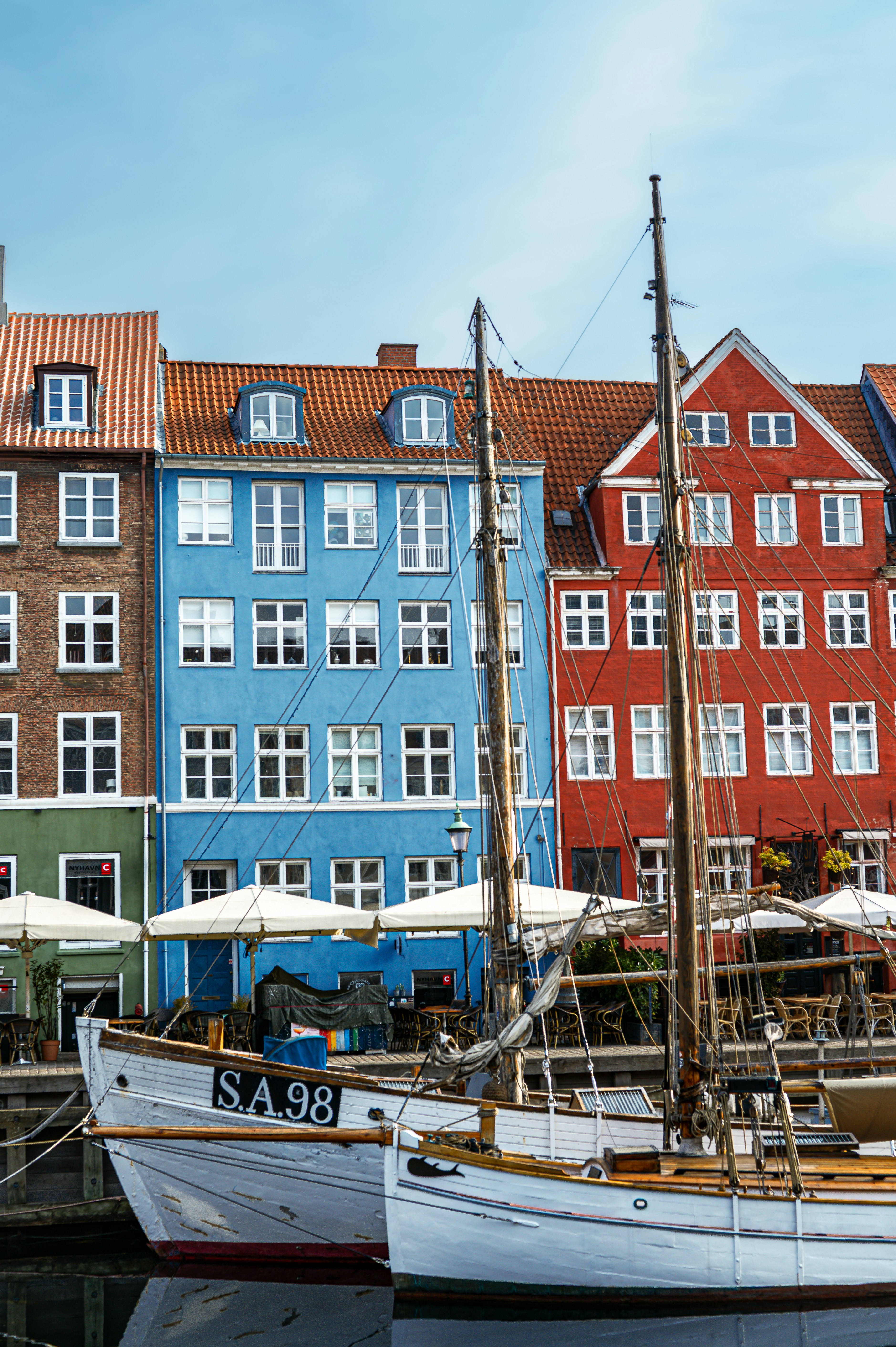 Colorful facades and masts: a harbor tableau