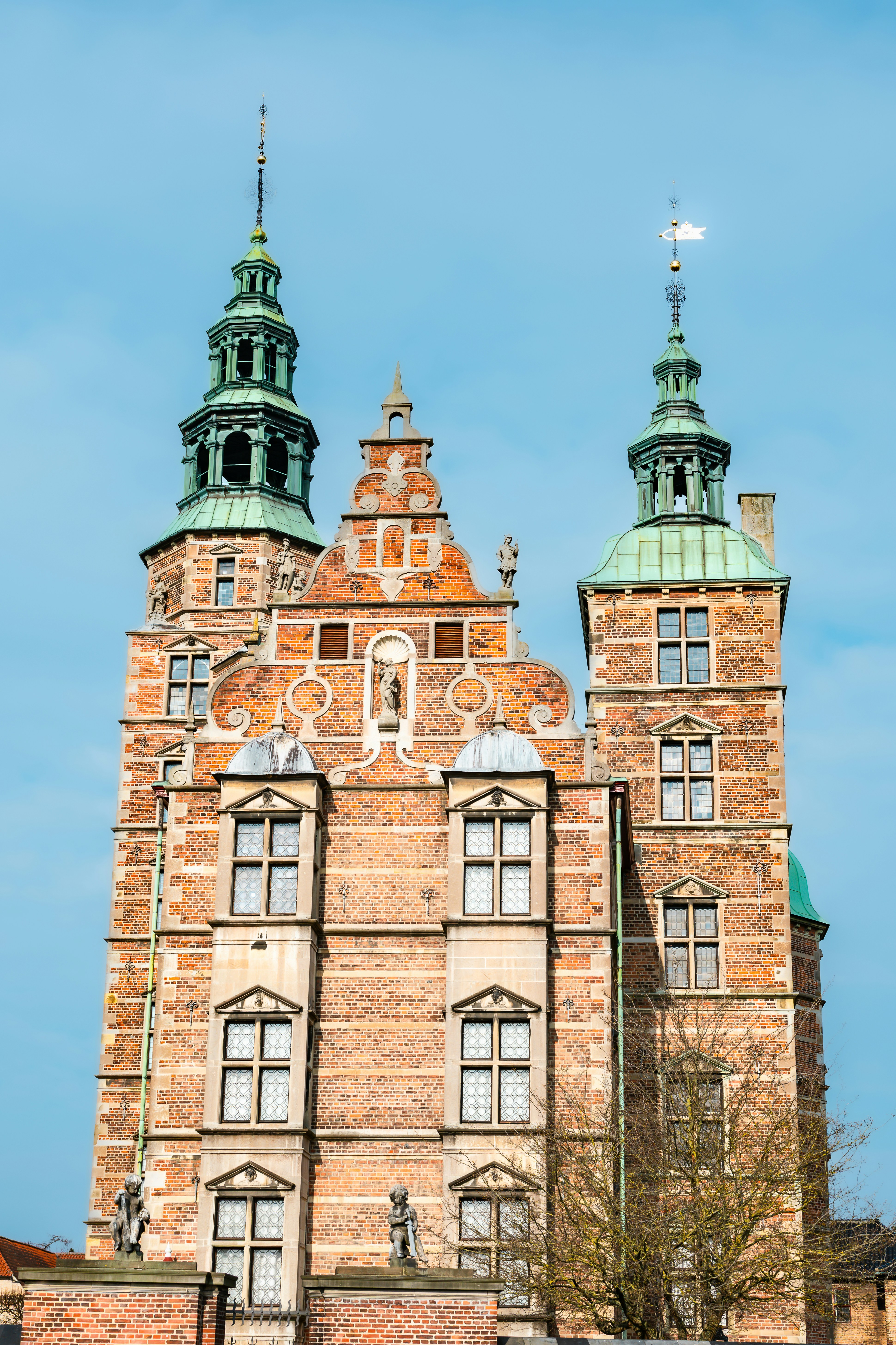 Brick Cathedral of Turrets Under a Clear Blue Sky