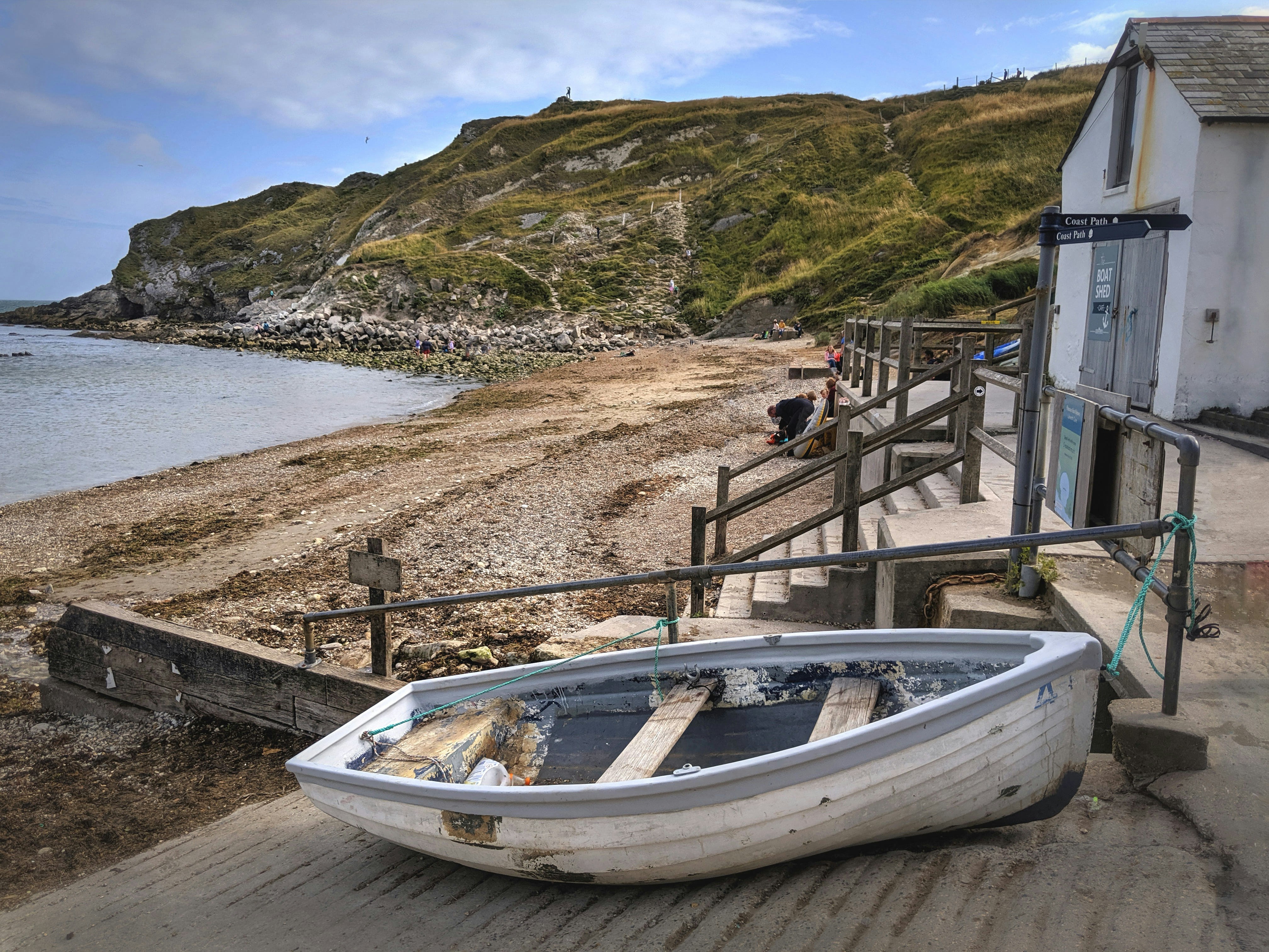 Low-tide Harbor: A Weathered Boat Quietly Anchored at the Cove