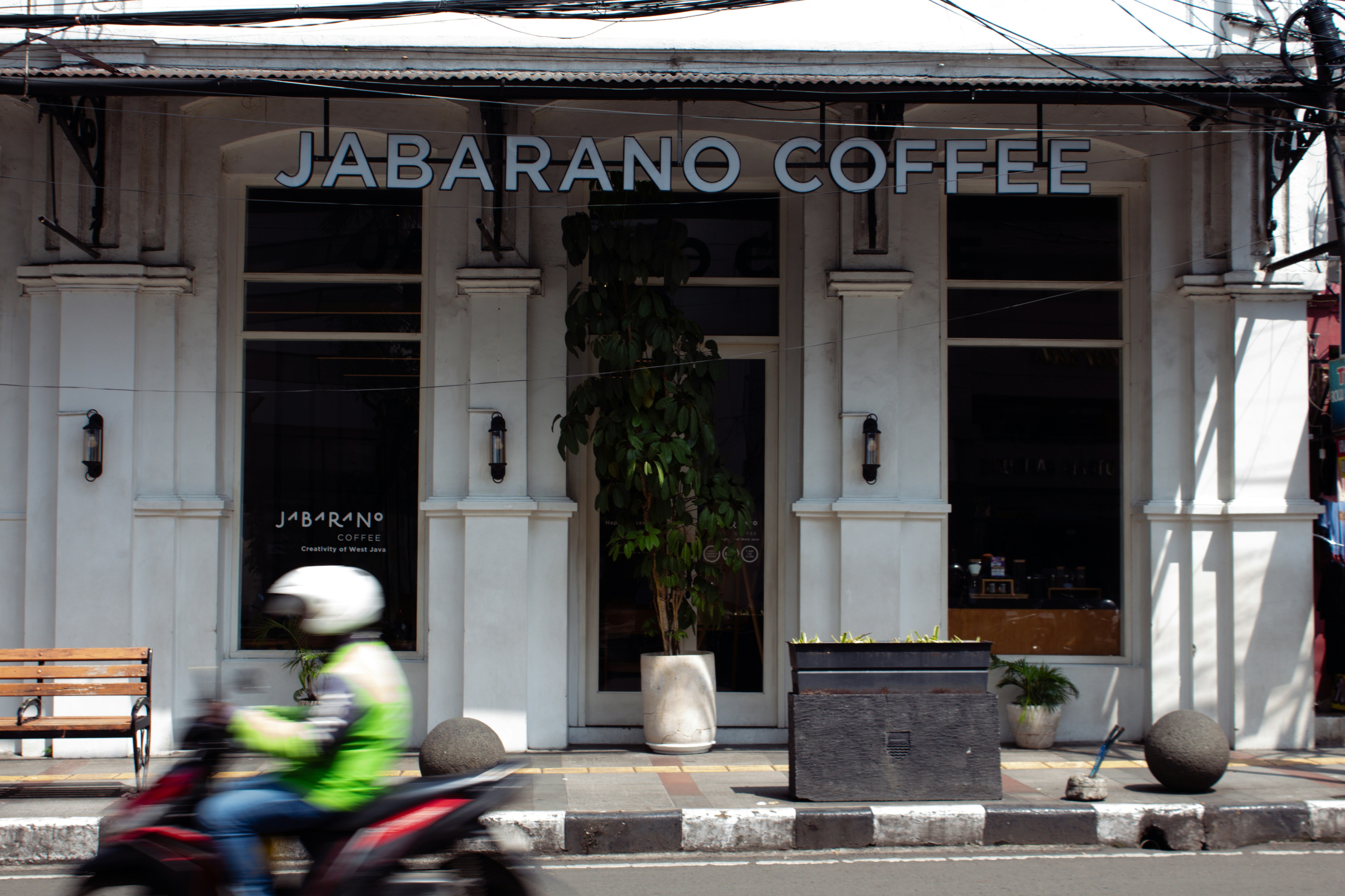 Jabarano Coffee in Motion: Street Scene with a Calm Facade