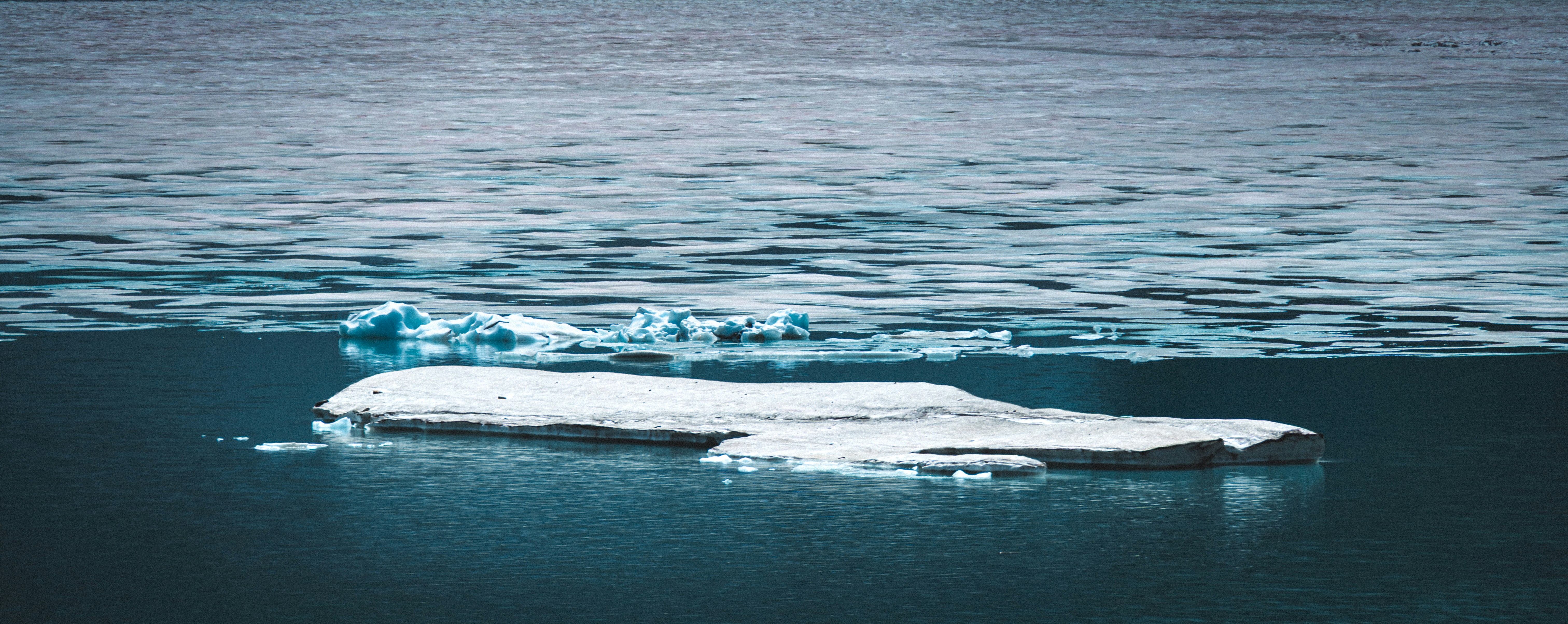 Floating Ice Ribbon: A Quiet Glacial Break in Calm Waters