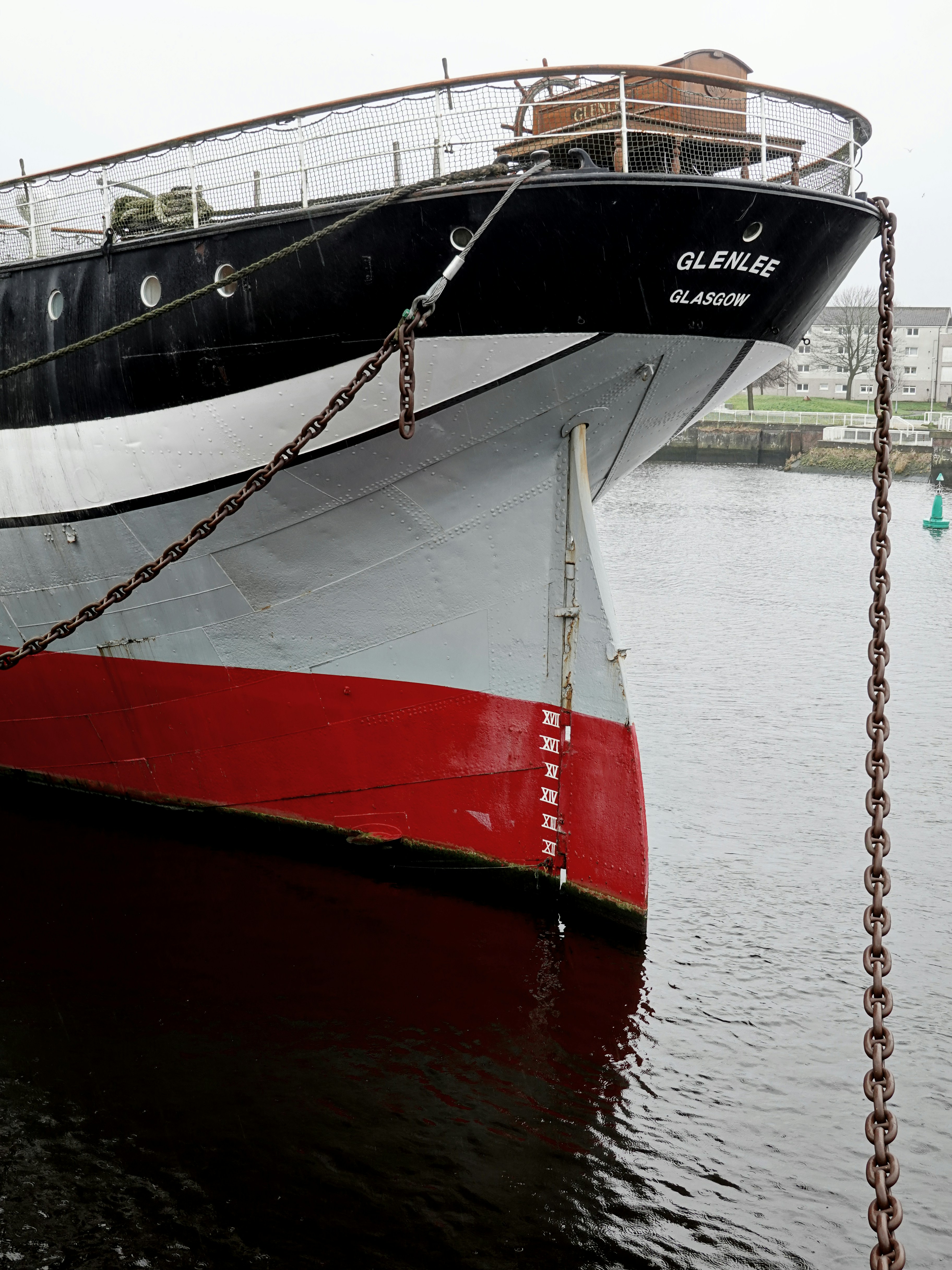 Glint of the Bow: A Dockside Studded with Chains