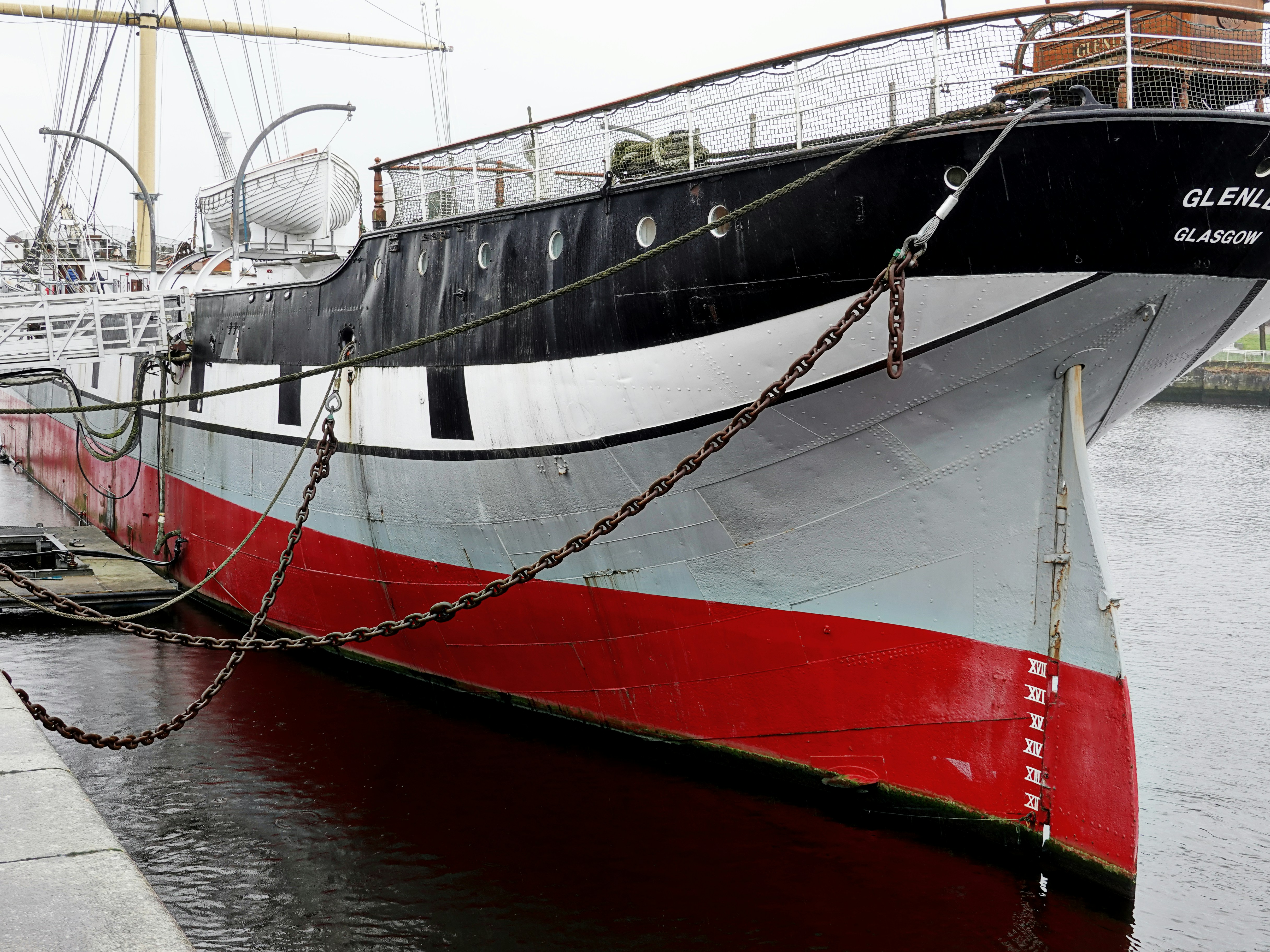 Bowline on the Red-hulled Vessel: A Quiet Dockside Portrait