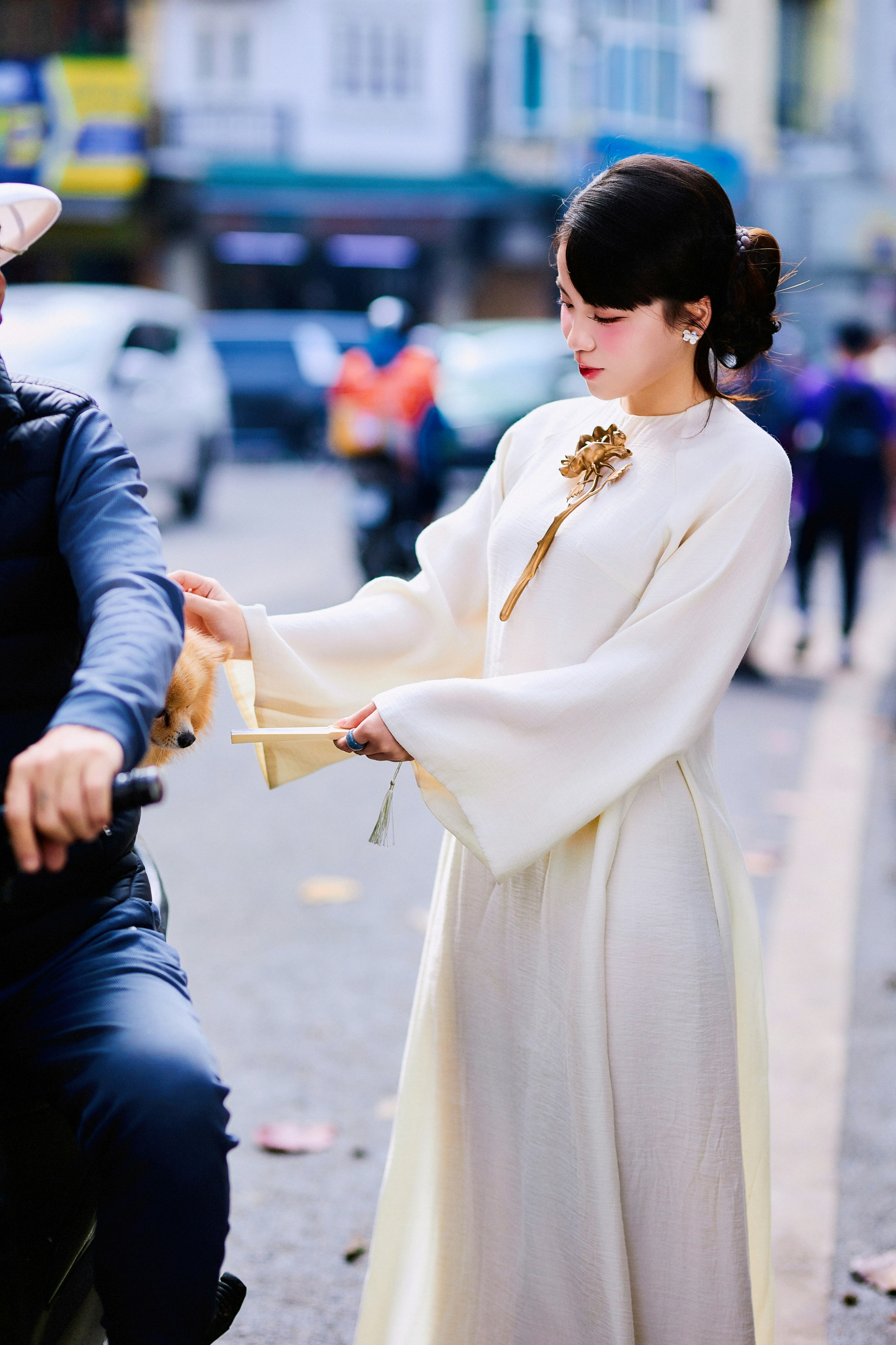 Gentle Motion in White: A Quiet Moment on the Street