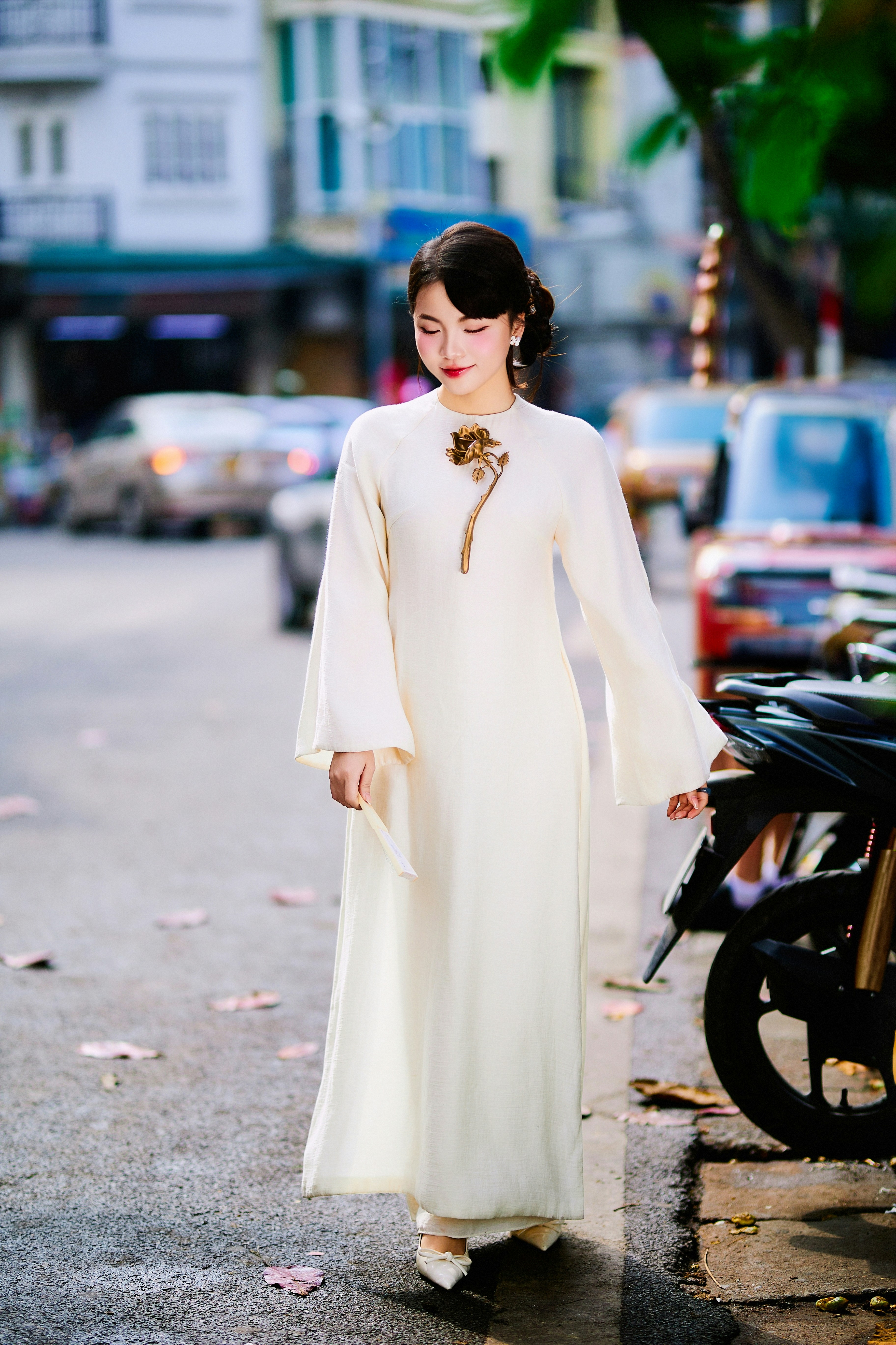 Quiet Grace on a Bustling Street: A Woman in Ivory