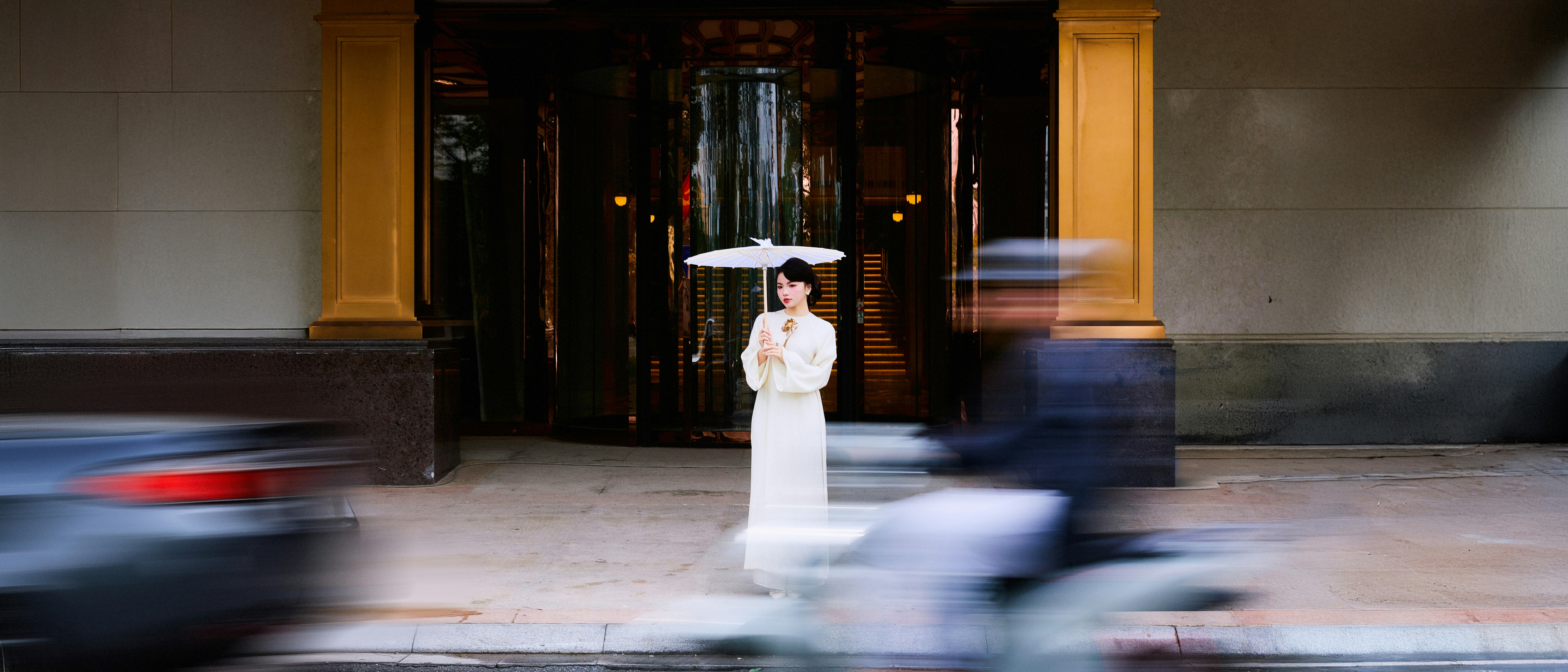 Bride with Parasol in a Street-Frame Blur