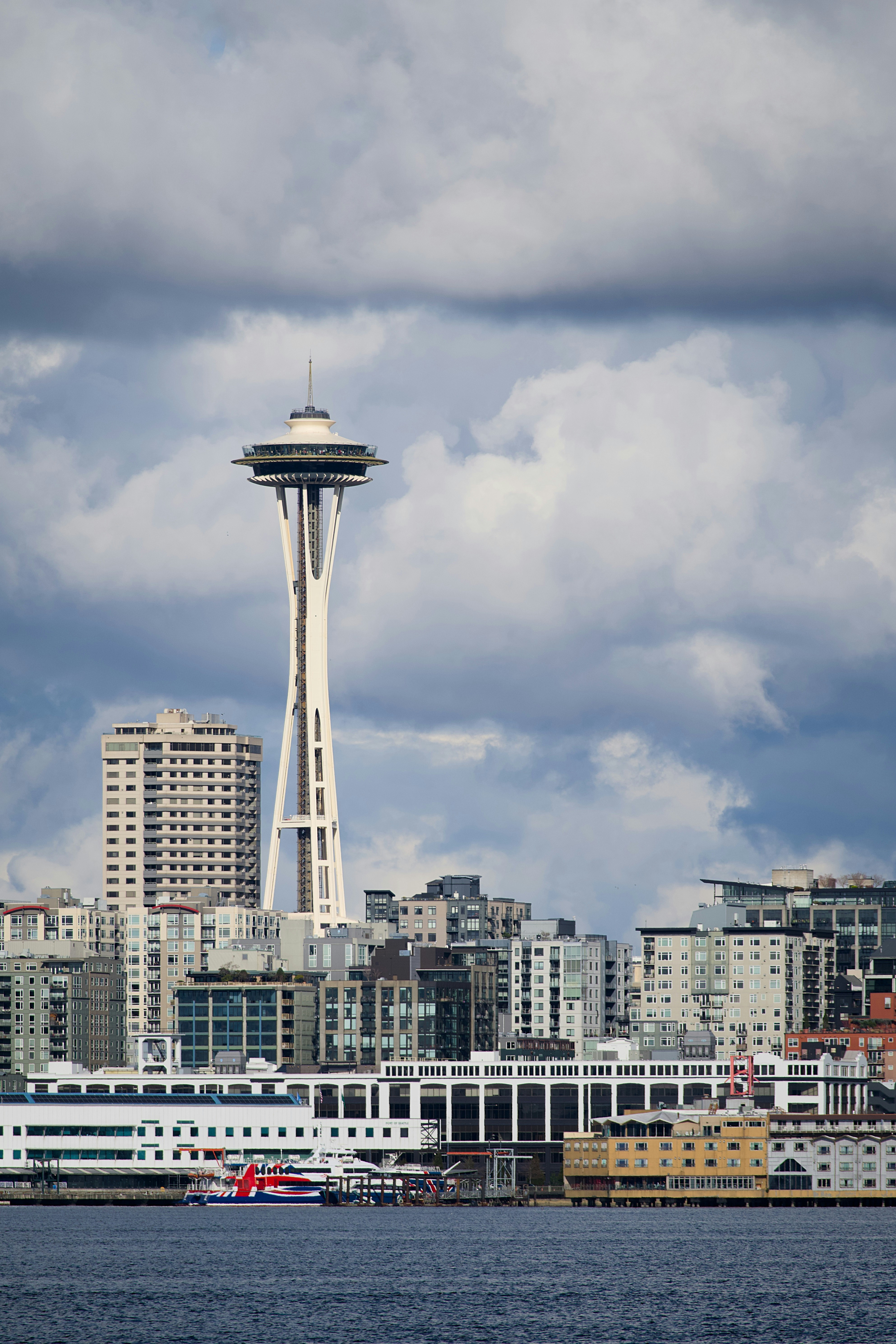 Seattle skyline under a vaulted sky with the Space Needle rising above the waterfront