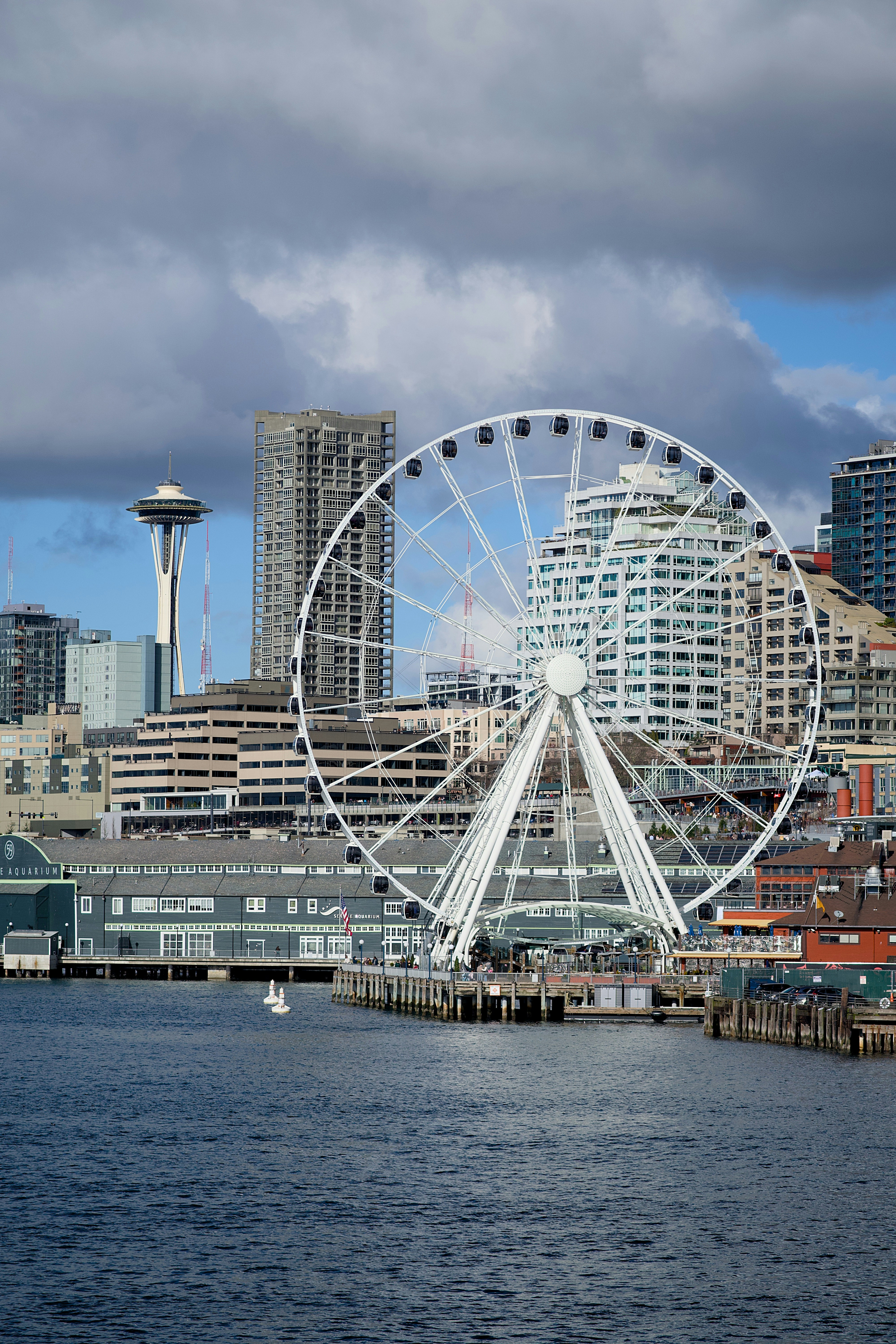 Seattle’s Waterfront Wheel: A Ferris Wheel Framed by Skyscraper silhouettes