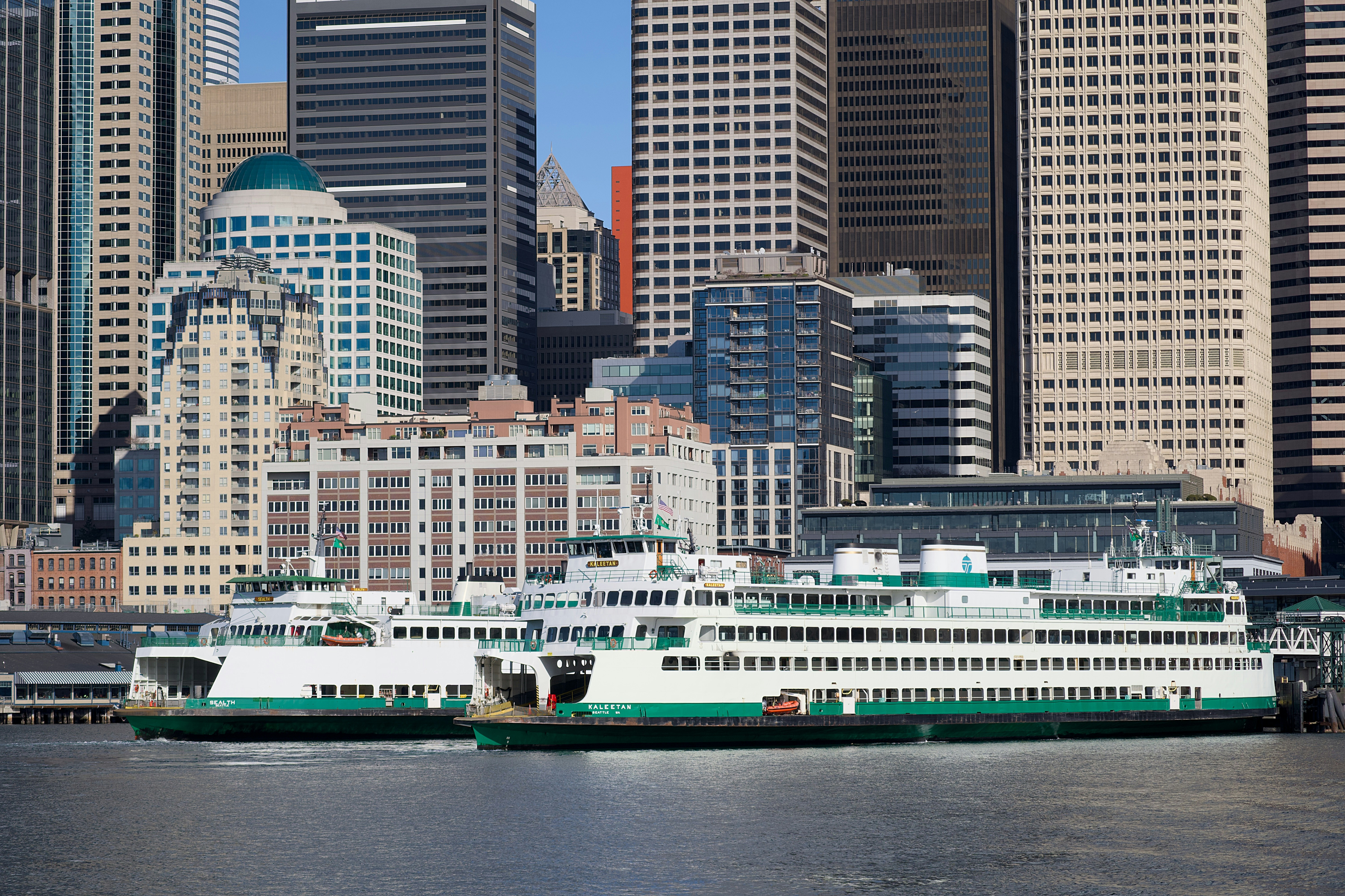 Harborfront Skyscrapers and Ferry Parade