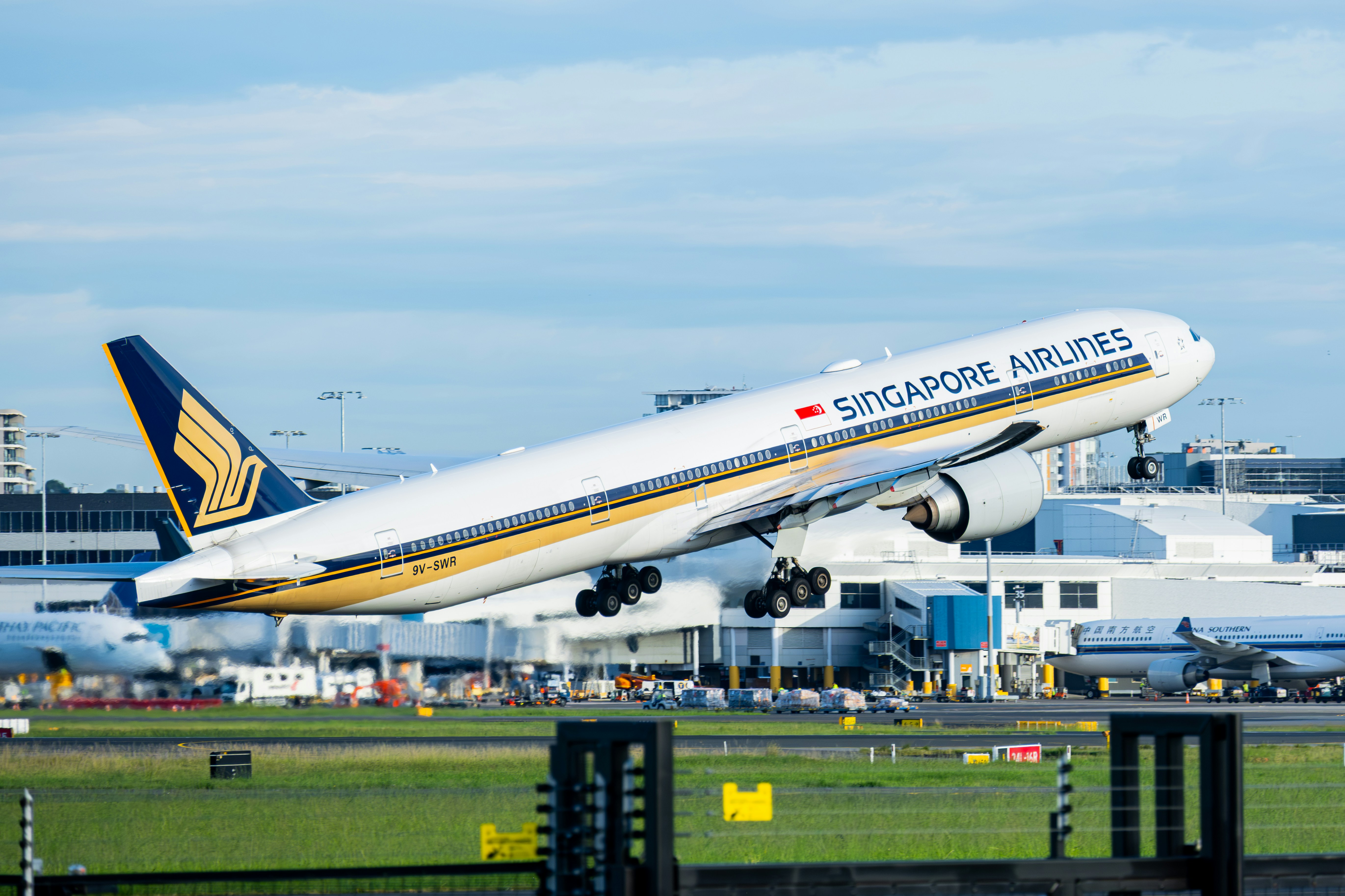 Takeoff into the Blue: Singapore Airlines 787 Lifts Off Past the Terminal