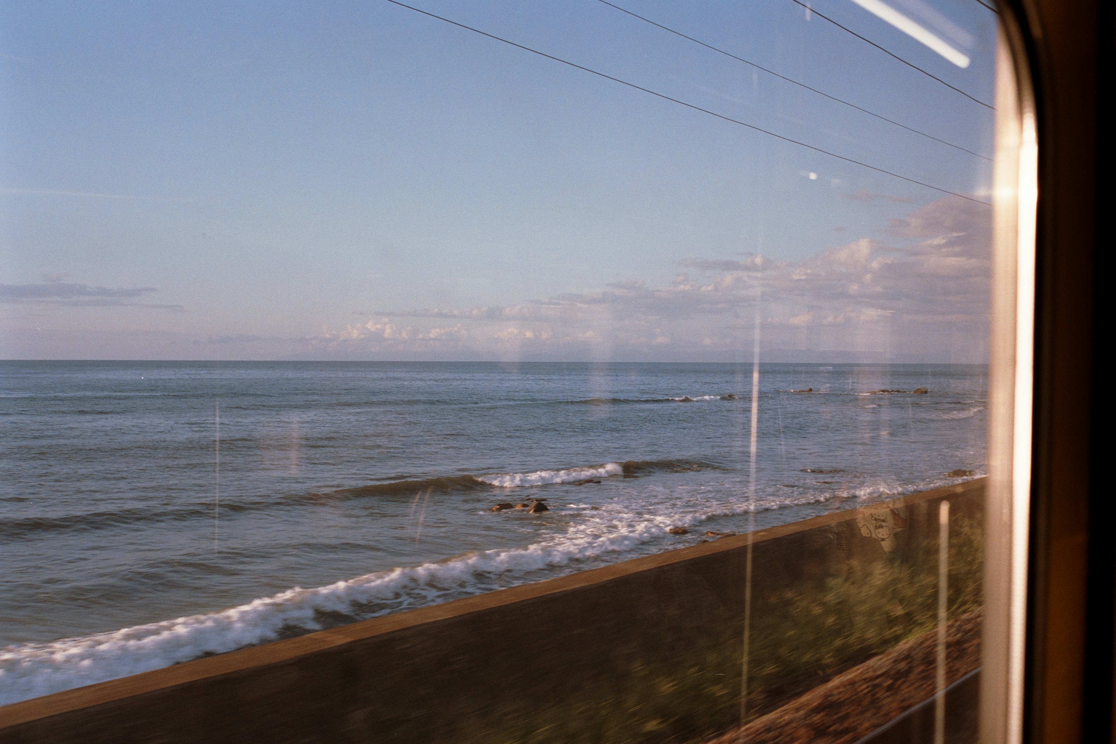 Coastal Horizon Through a Train Window