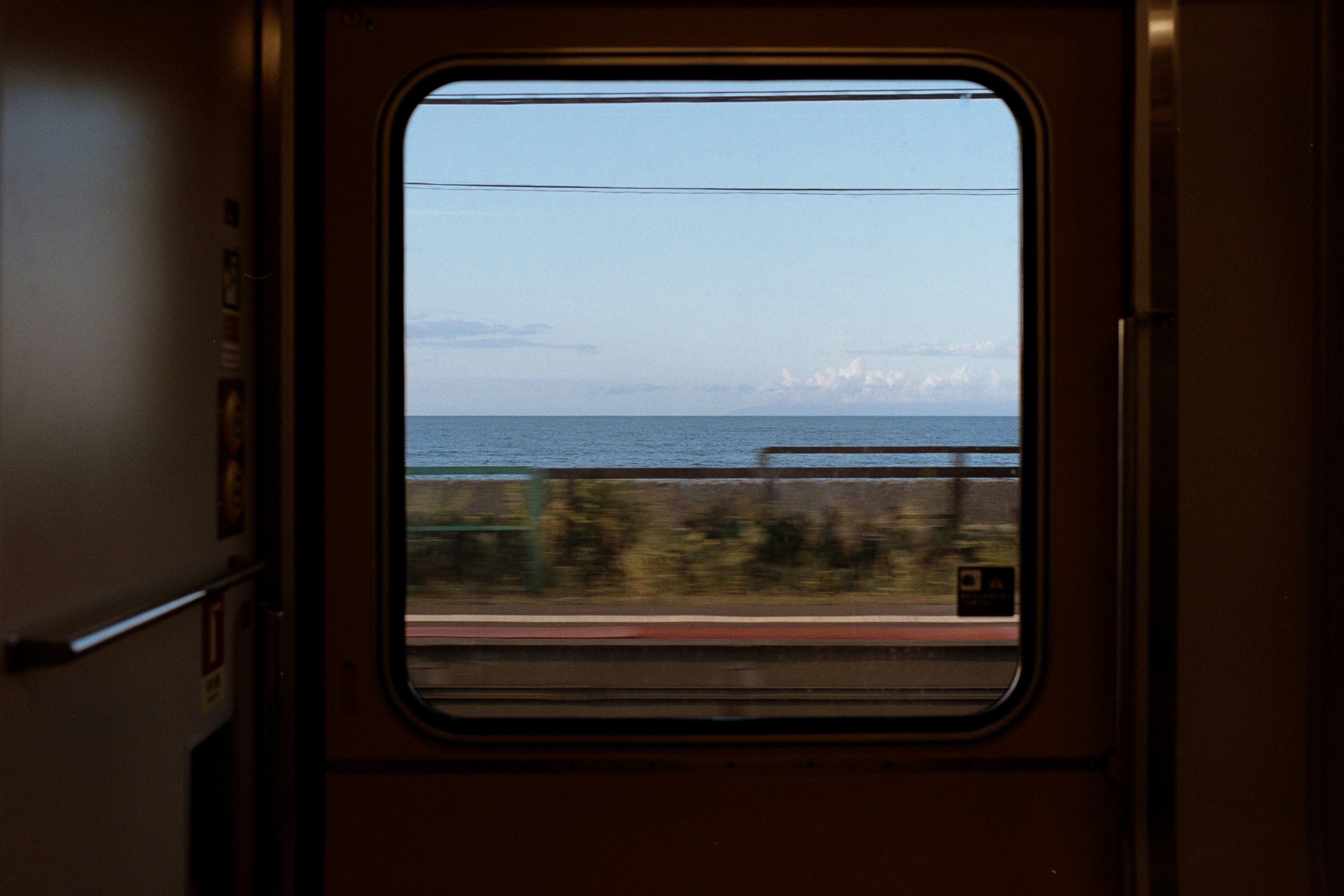 Window to the Sea: Light at the Train Door