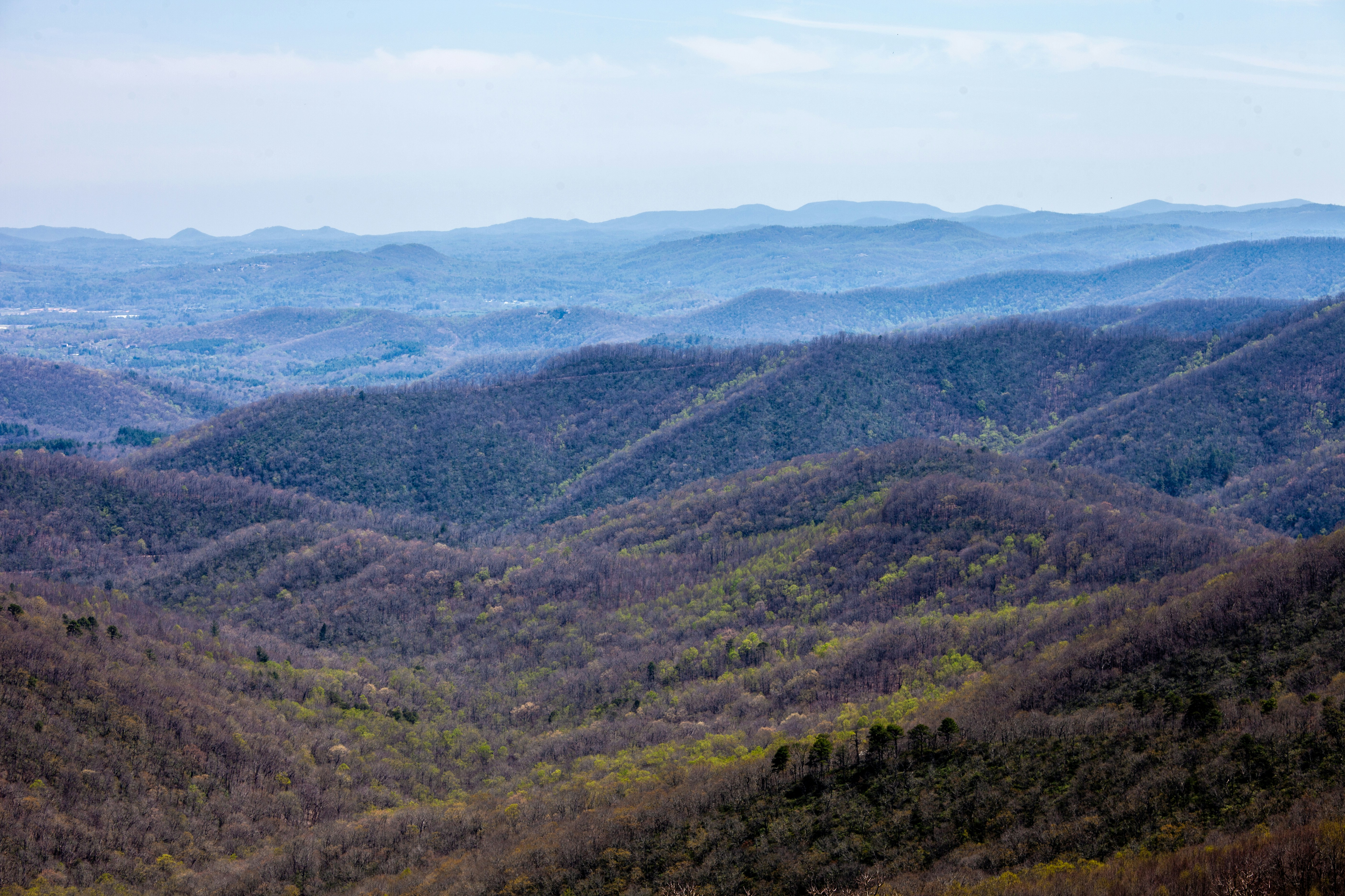 Mist-Laced Ridge Lines Beyond the Blue Horizon