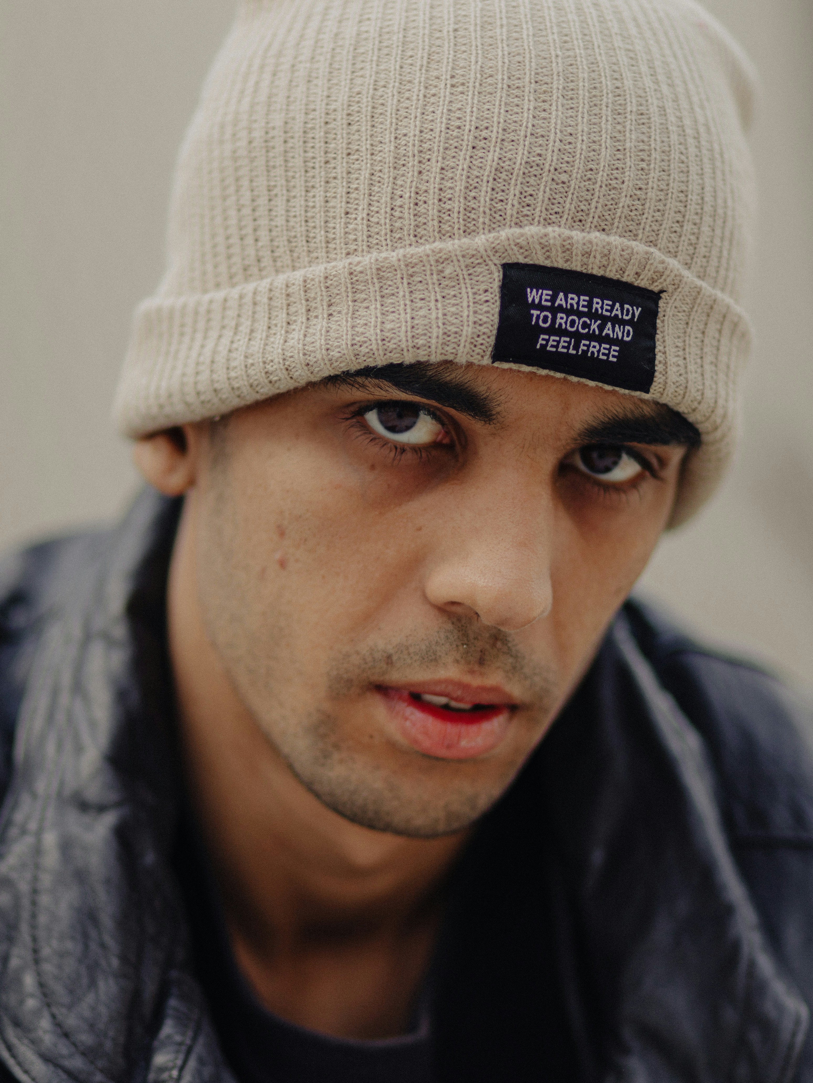 Intent in a Beanie: A Direct Gaze Under Soft Light