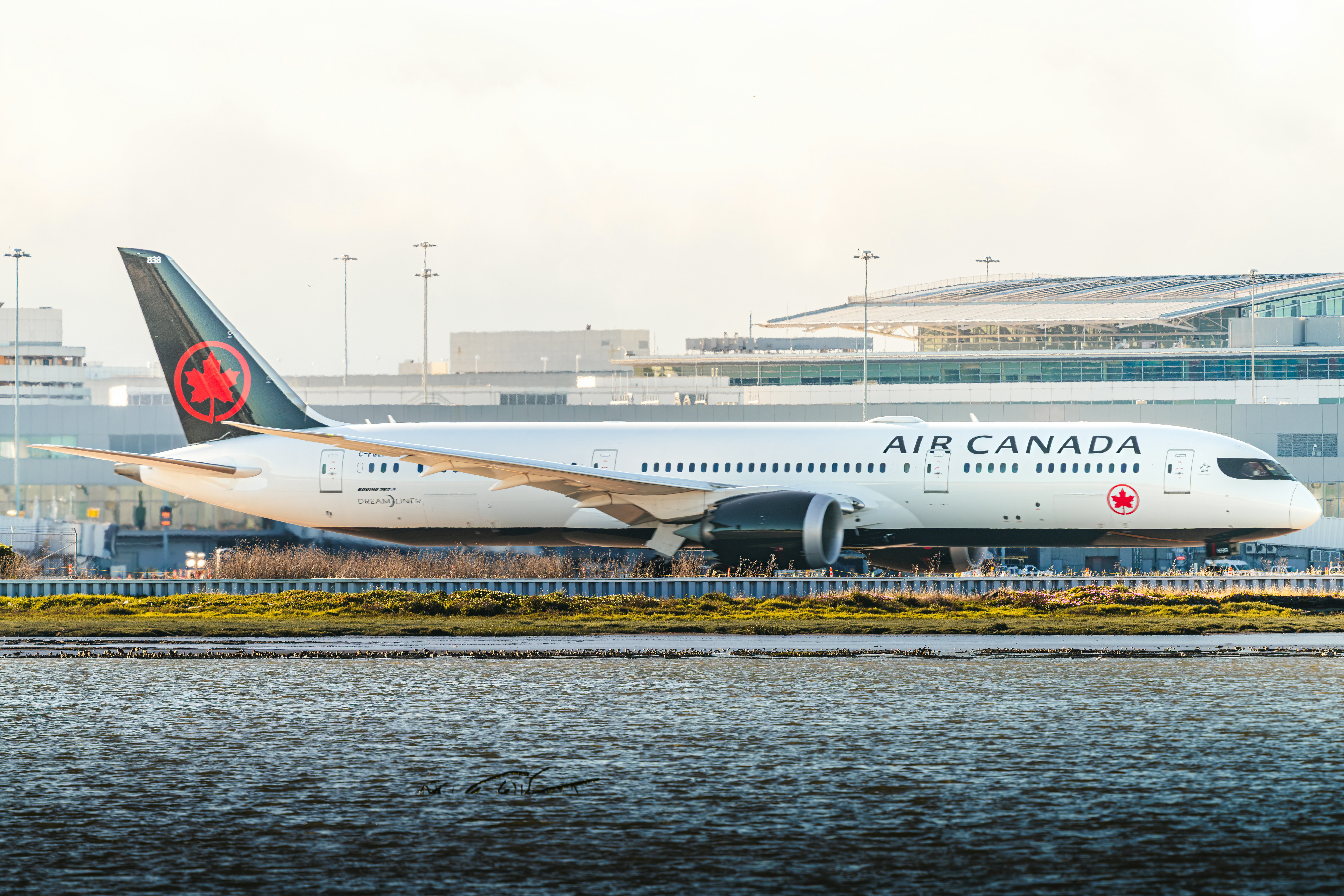 Air Canada Dreamliner at the Waterline: Quiet Strength on the Tarmac