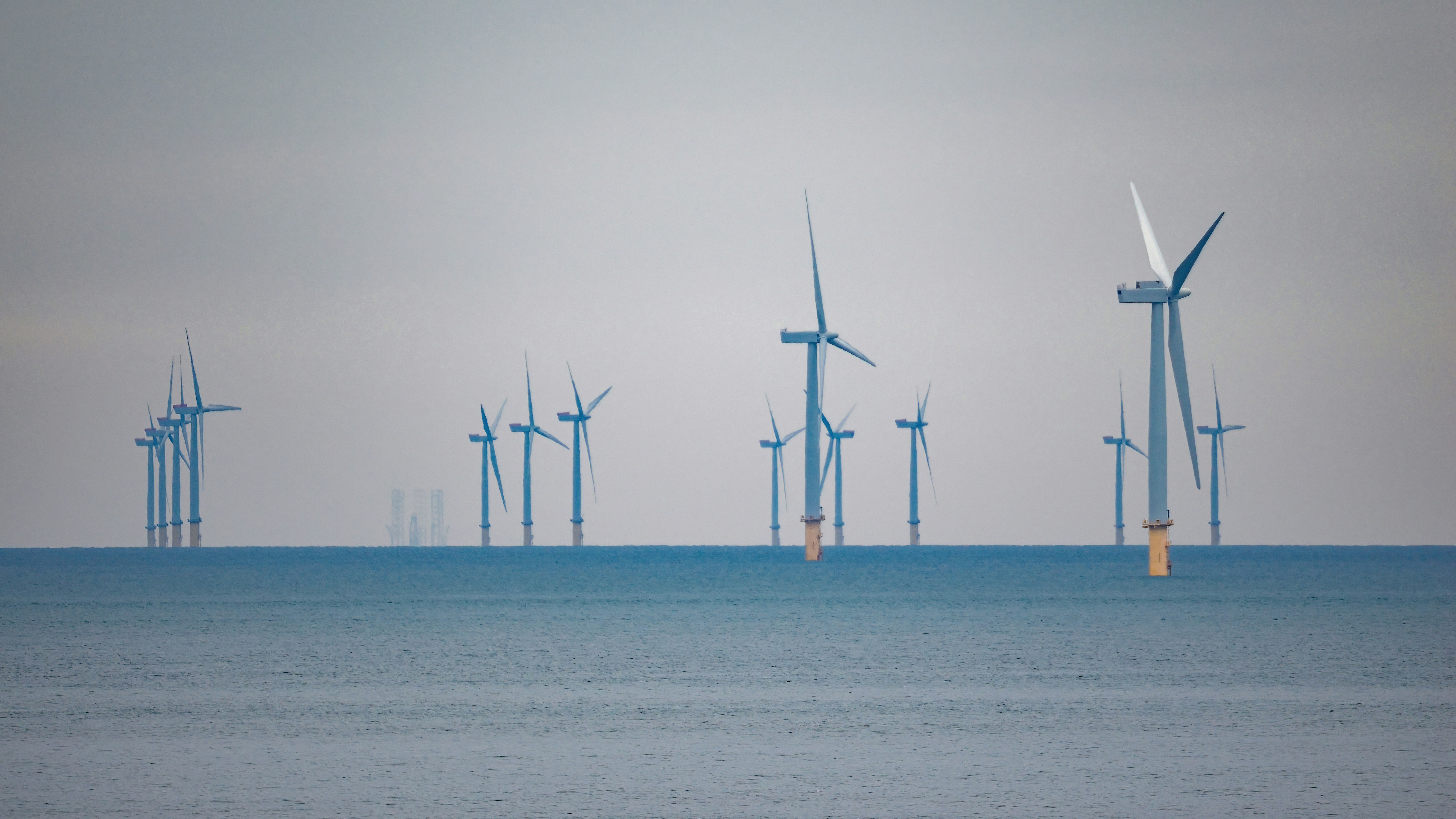 Silent Giants of the Sea: Offshore Wind Turbines at Dusk