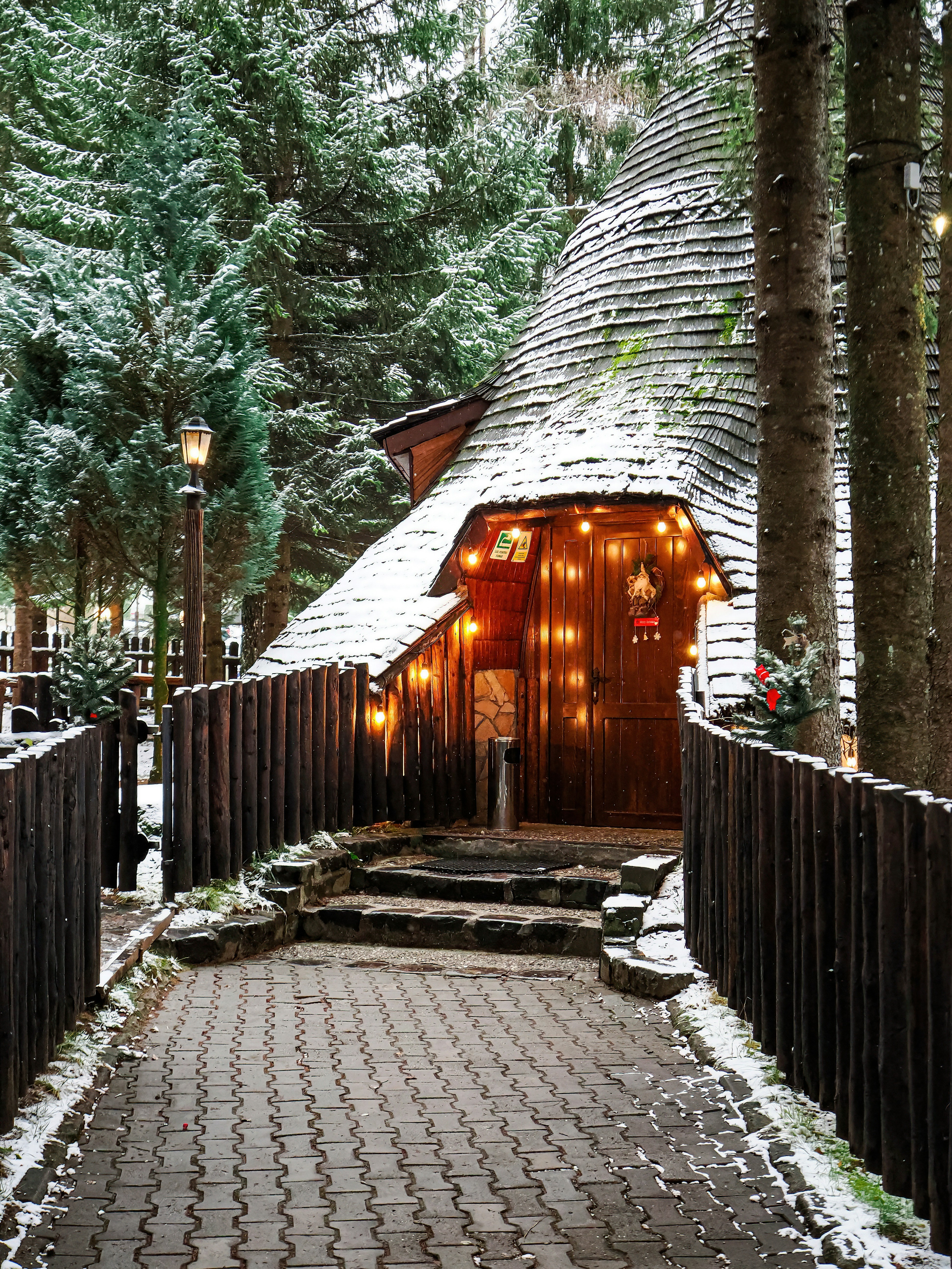 Snow-kissed Chalet Gateway bathed in amber light