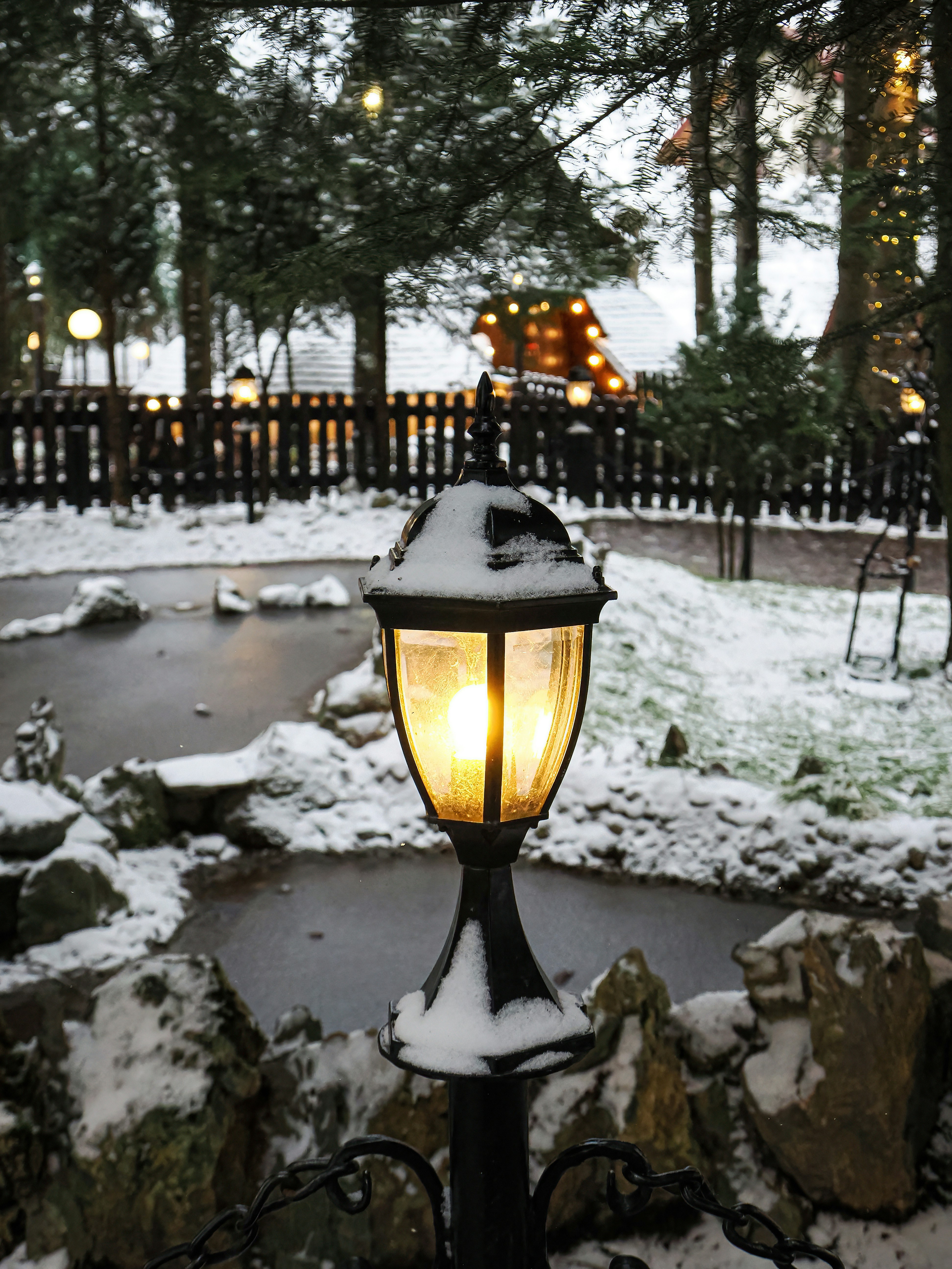 Glowing Lantern in a Snow-Capped Garden