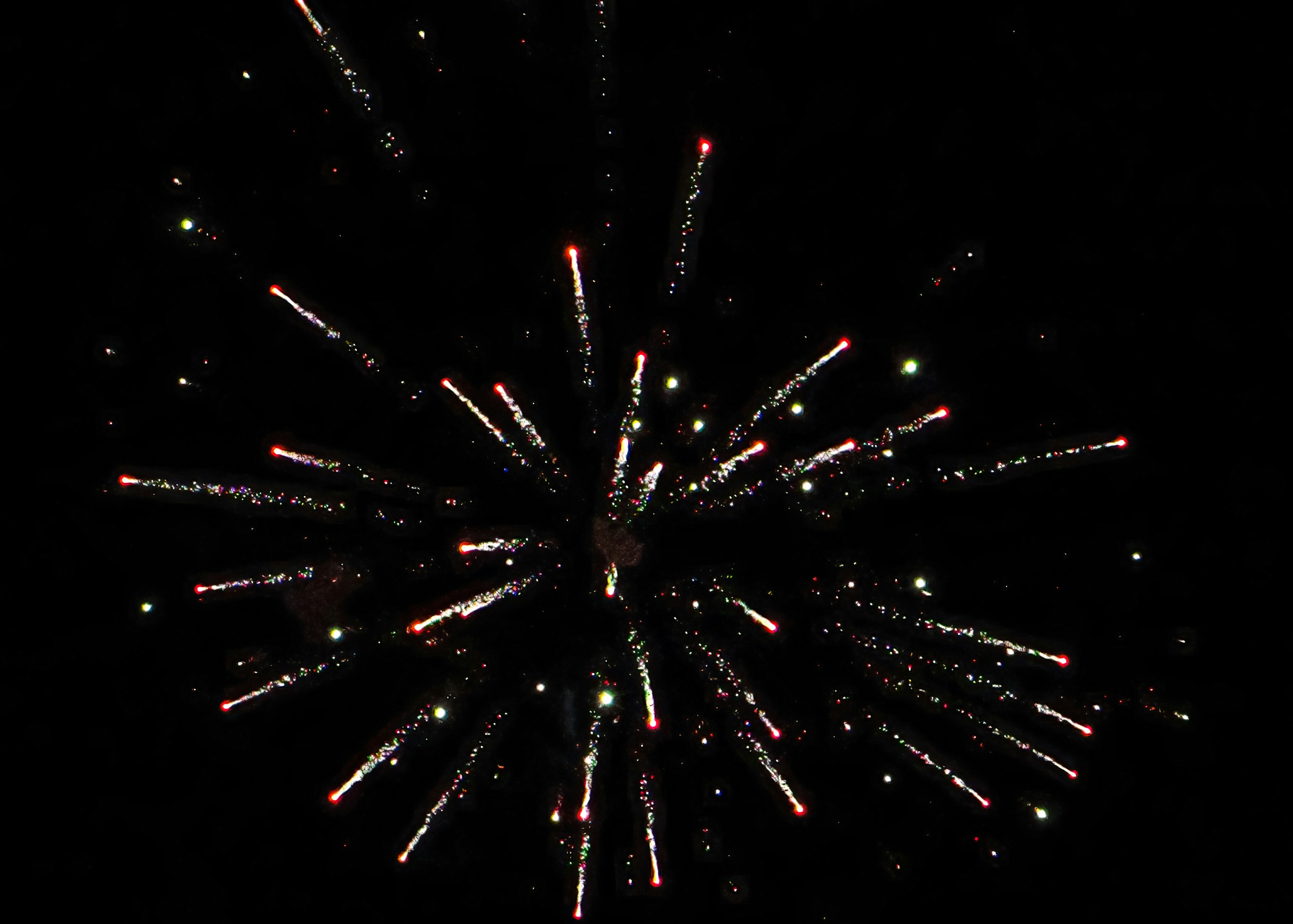 Midnight Firework Burst Over a Silent Night Sky
