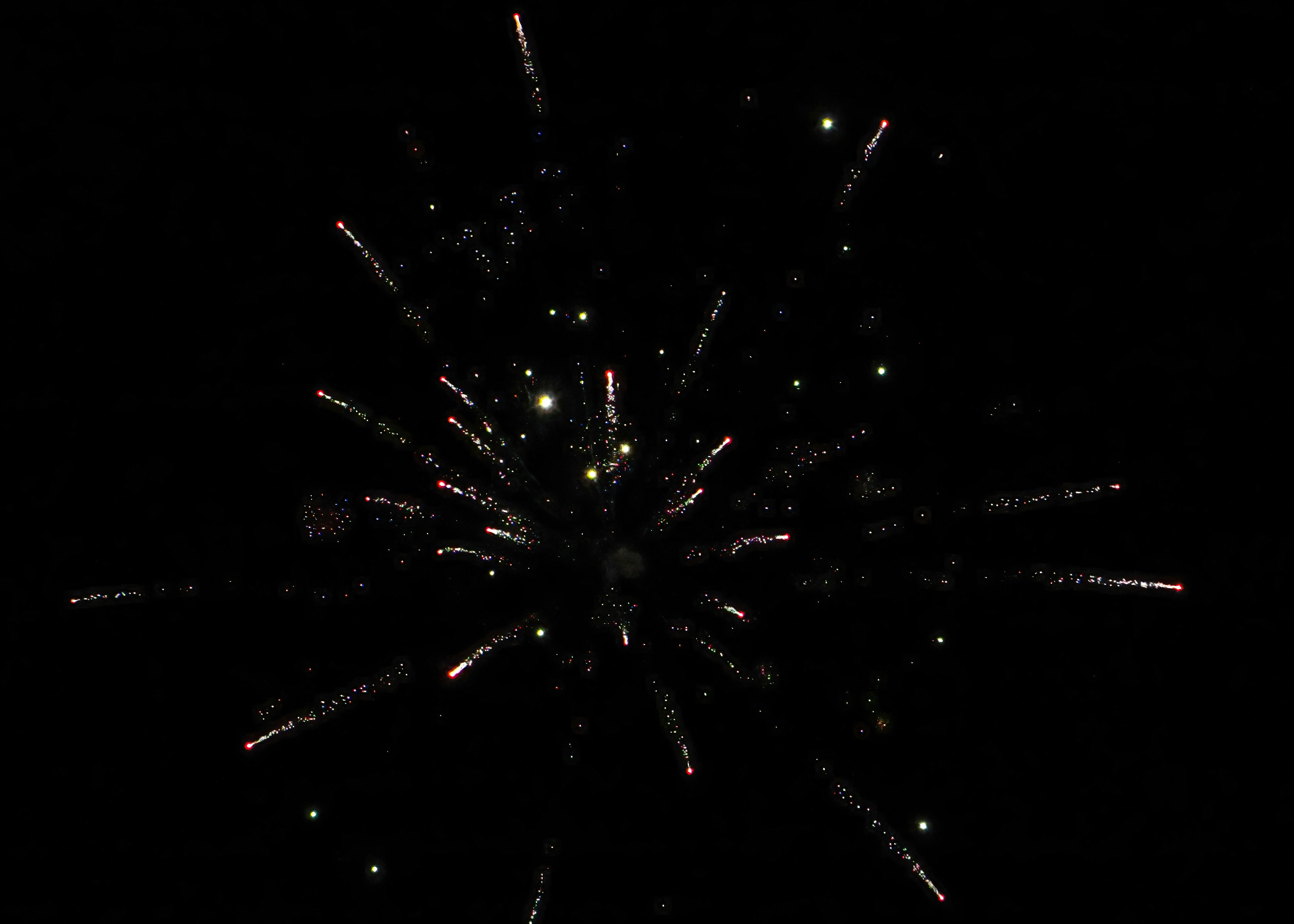 Firework Bloom in the Night: Central Sparkle Across the Void