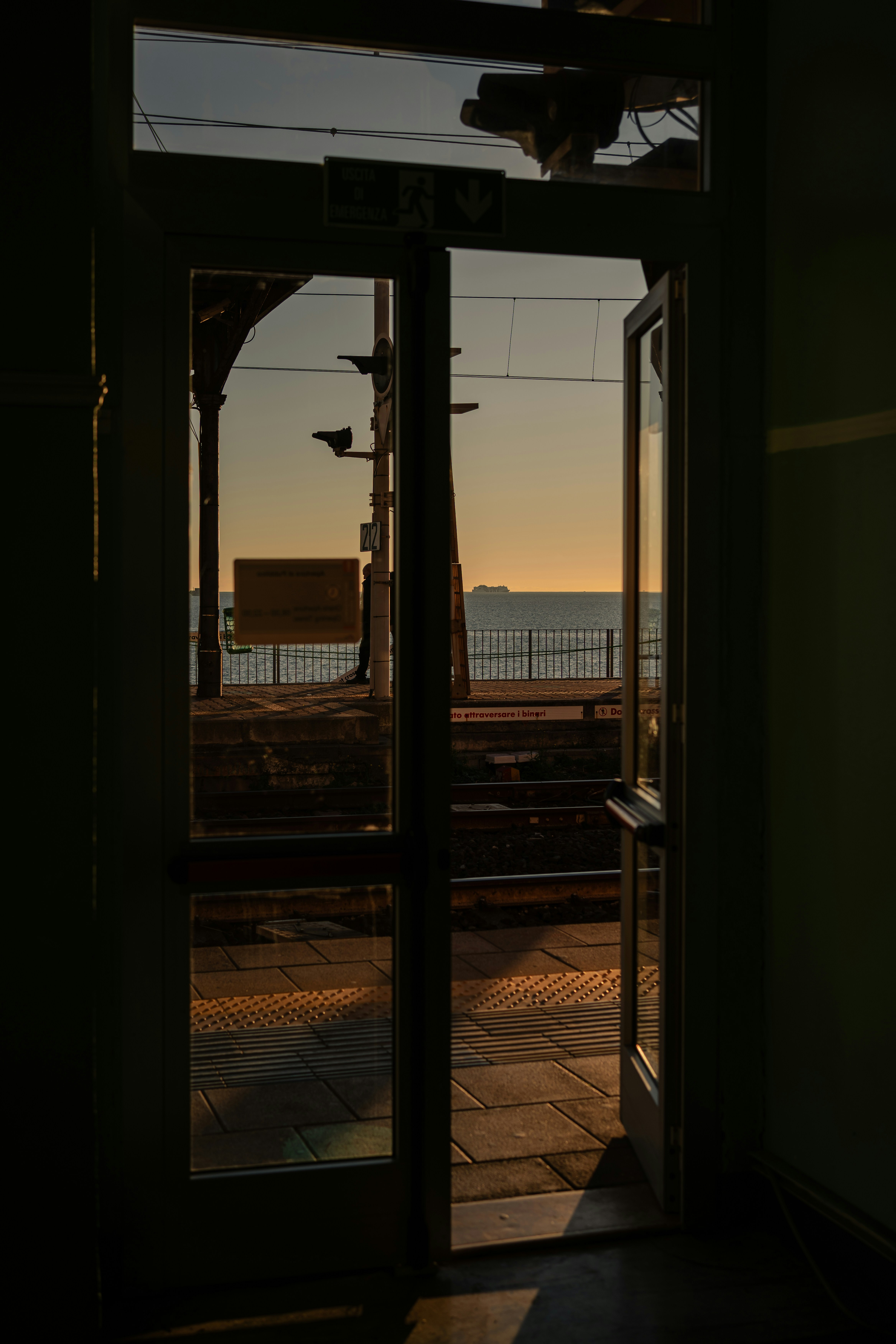 Sunlit Ocean Fragments Through a Dusk-Opening Door