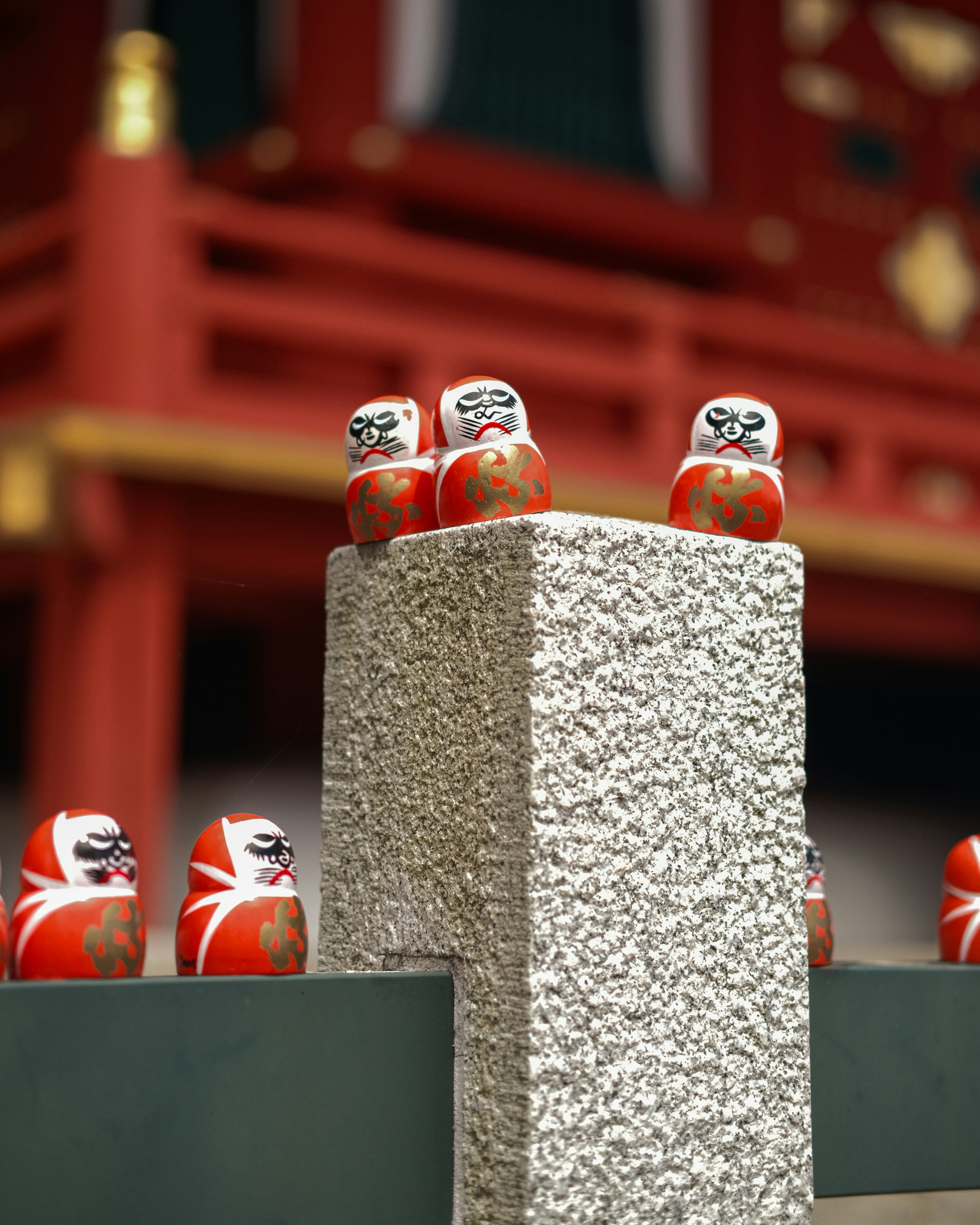 Nest of Daruma: Red Beads atop a Granite Pedestal