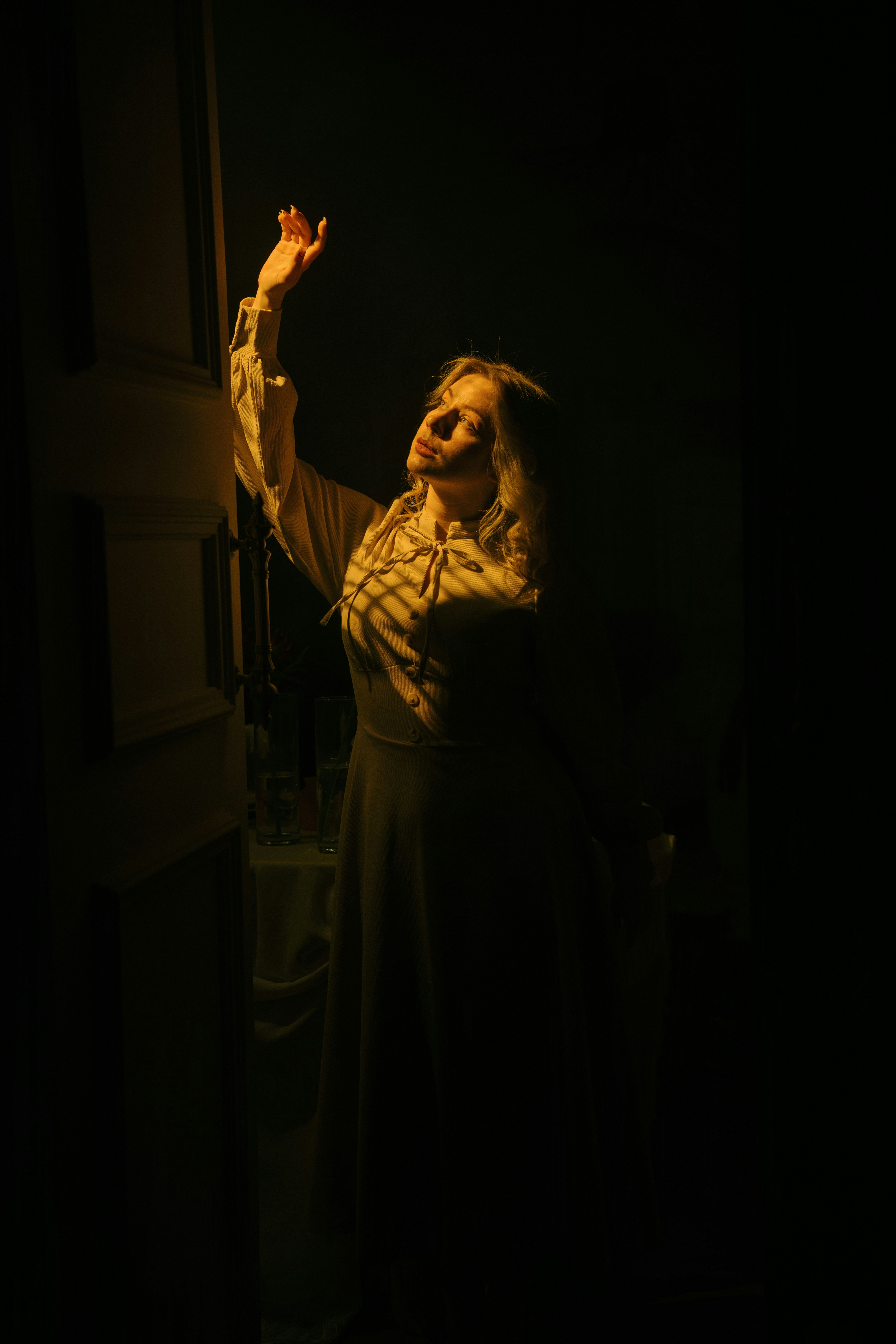 Glow in the Doorway: a softly lit portrait in amber tones