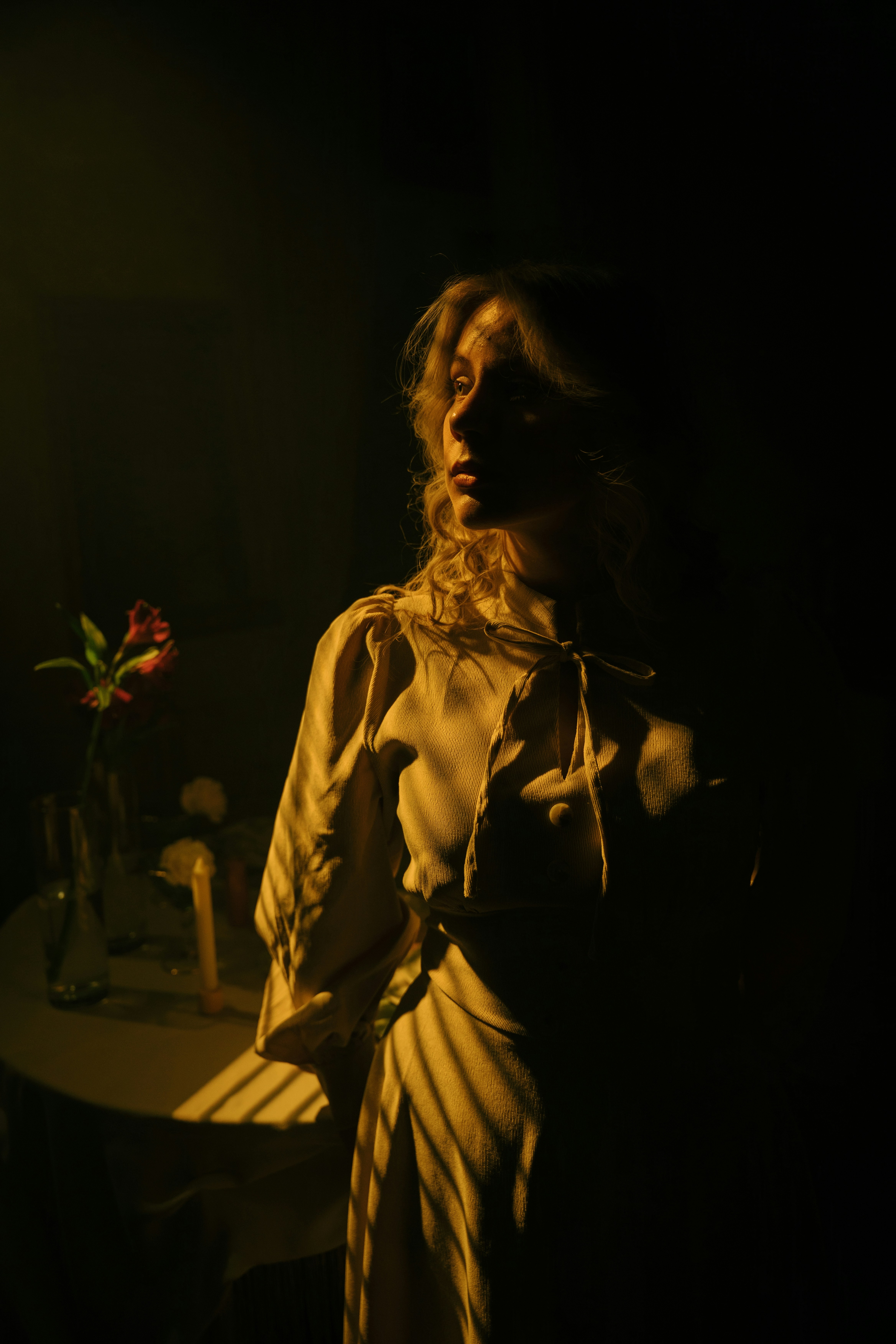 Silent Spotlight: A Woman in Warm Shadowed Light