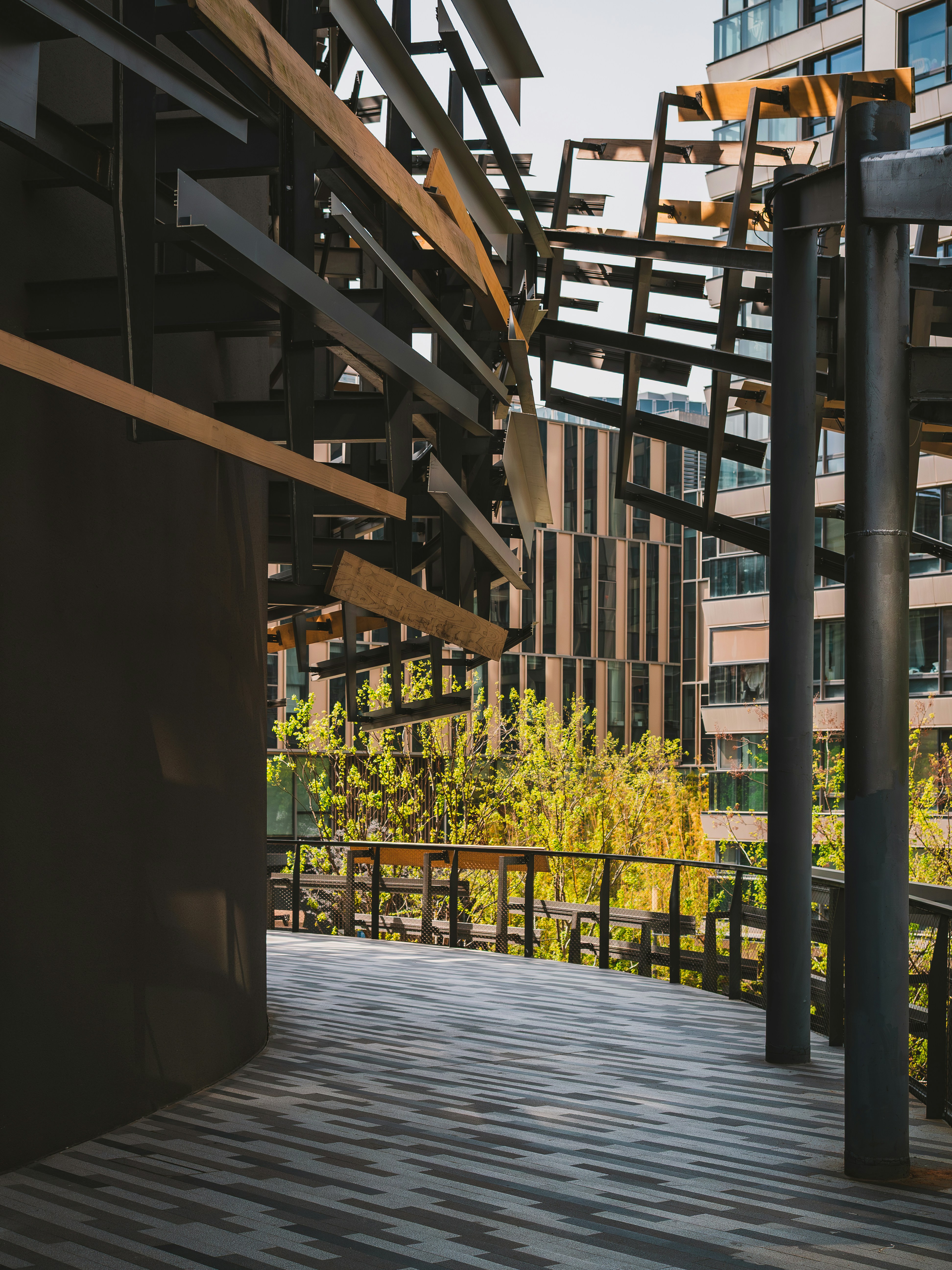 Urban Echoes: Intersecting Beams and Sunlit Atrium