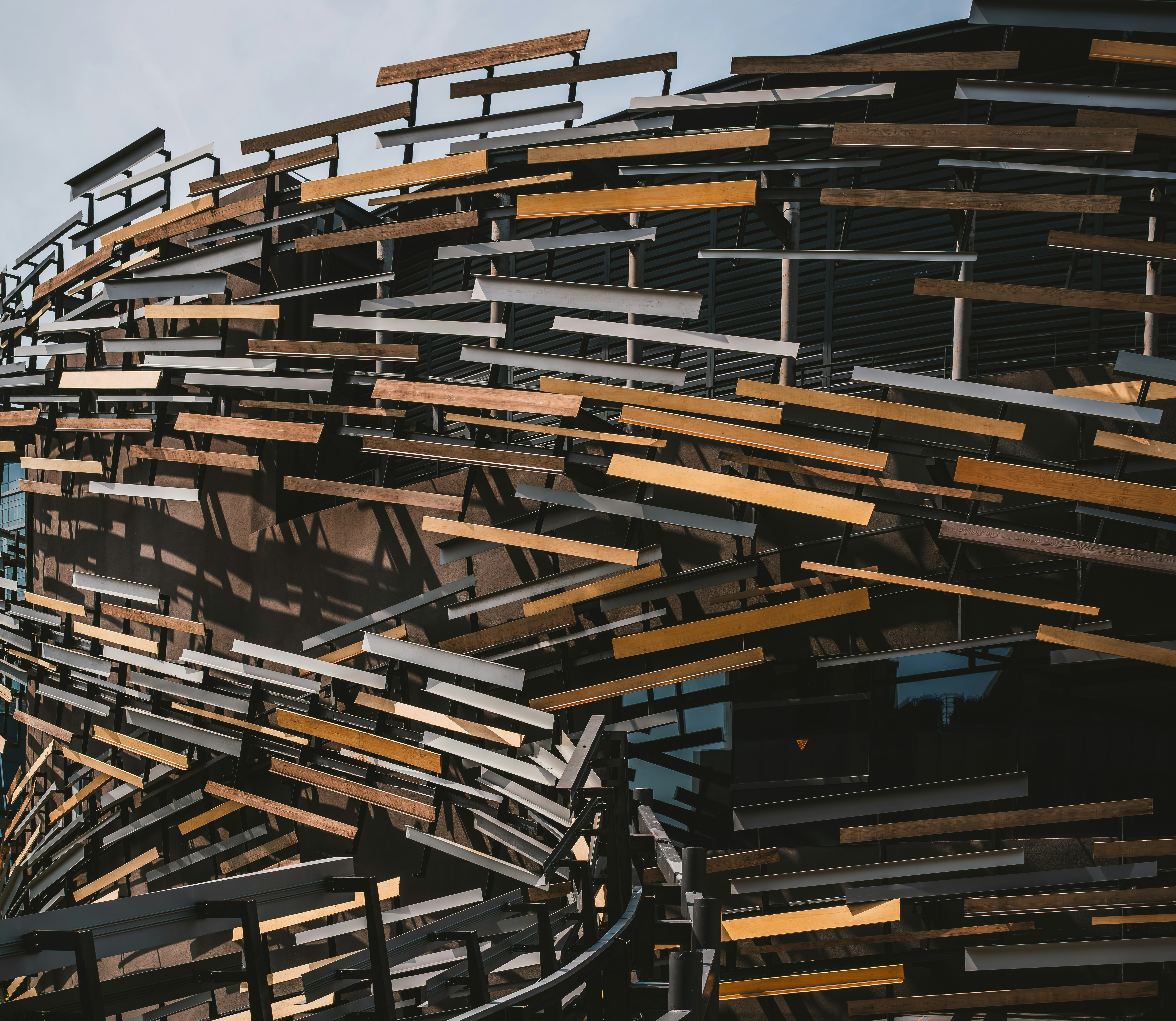 Architectural Strata: Strips of Wood Adorning a Curved Facade