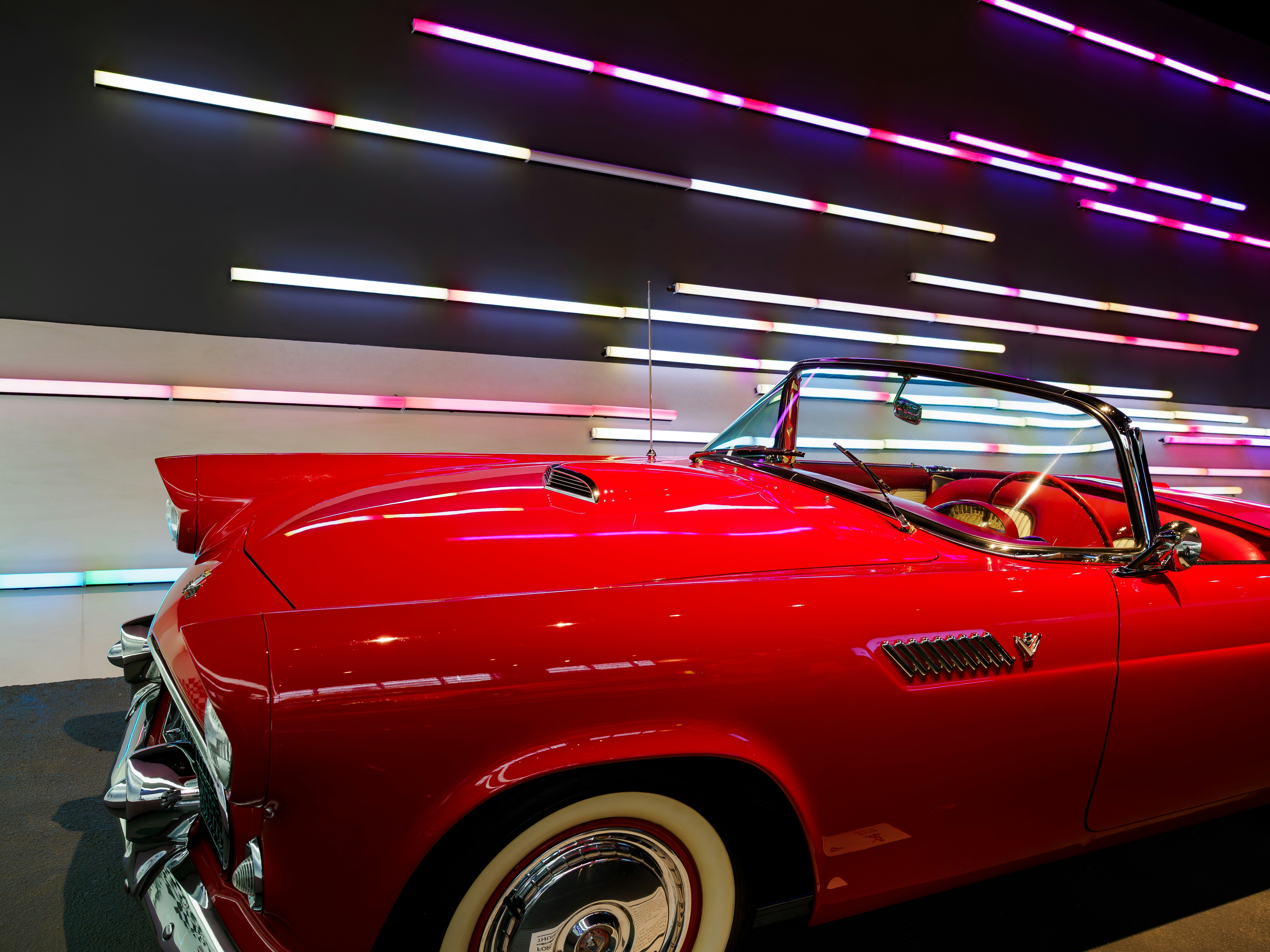 Crimson Convertible in Neon‑Streaked Studio