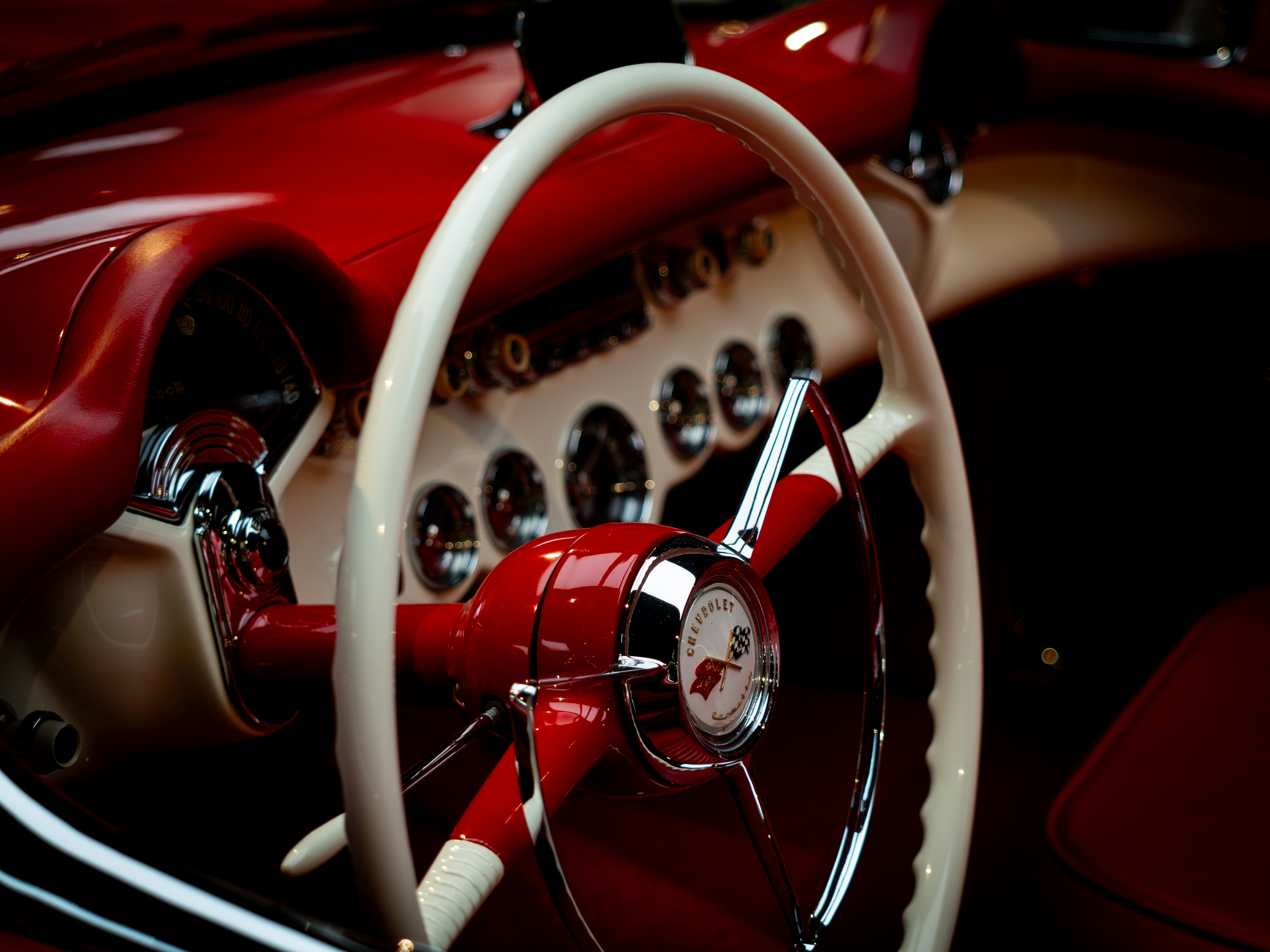 Chrome Heartbeat: The Red Dashboard of a Classic Car
