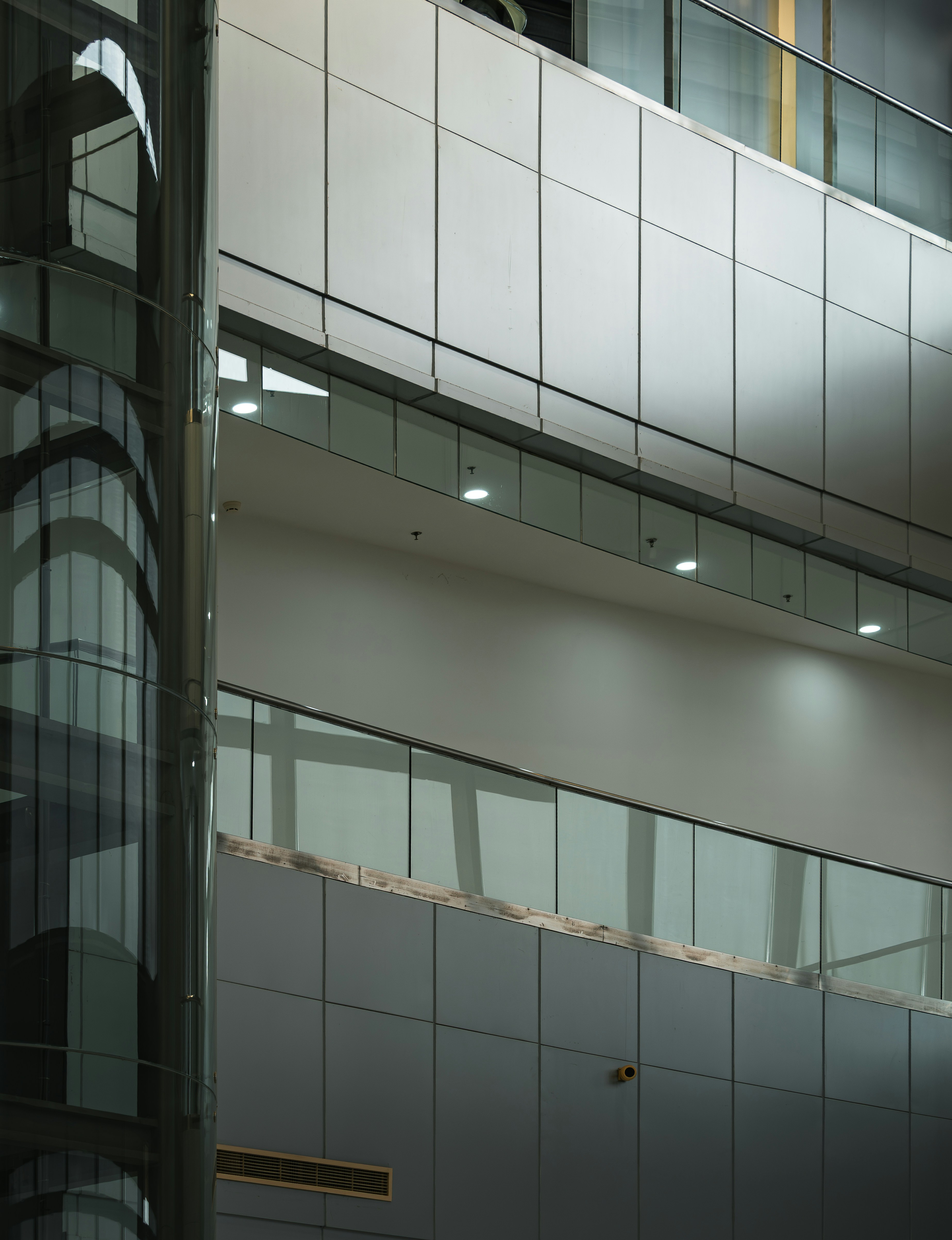Glass Facade Rings: A Quiet Moment Inside a Modern Atrium
