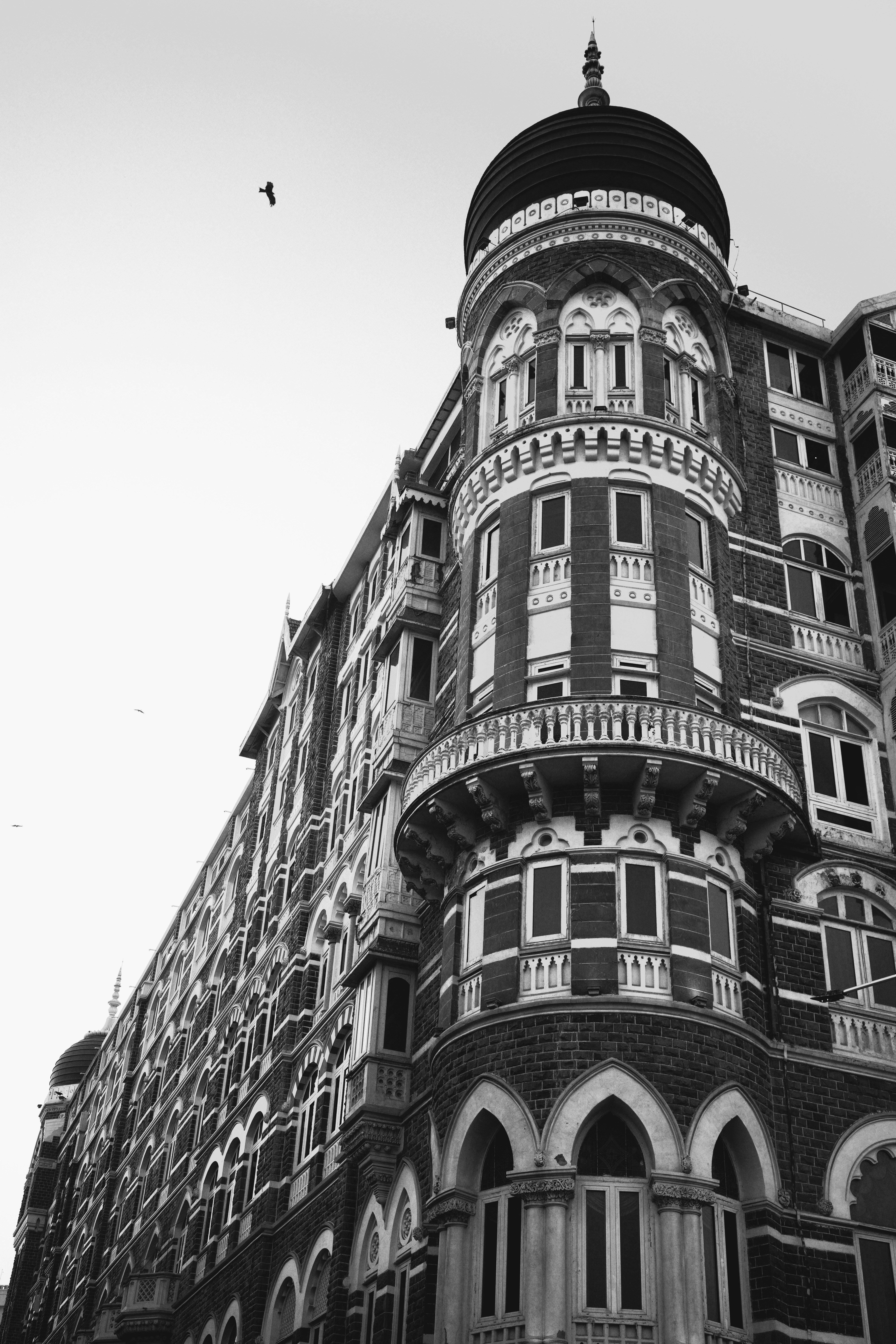 Ornate Miniature Tower Rises from Brick Facade