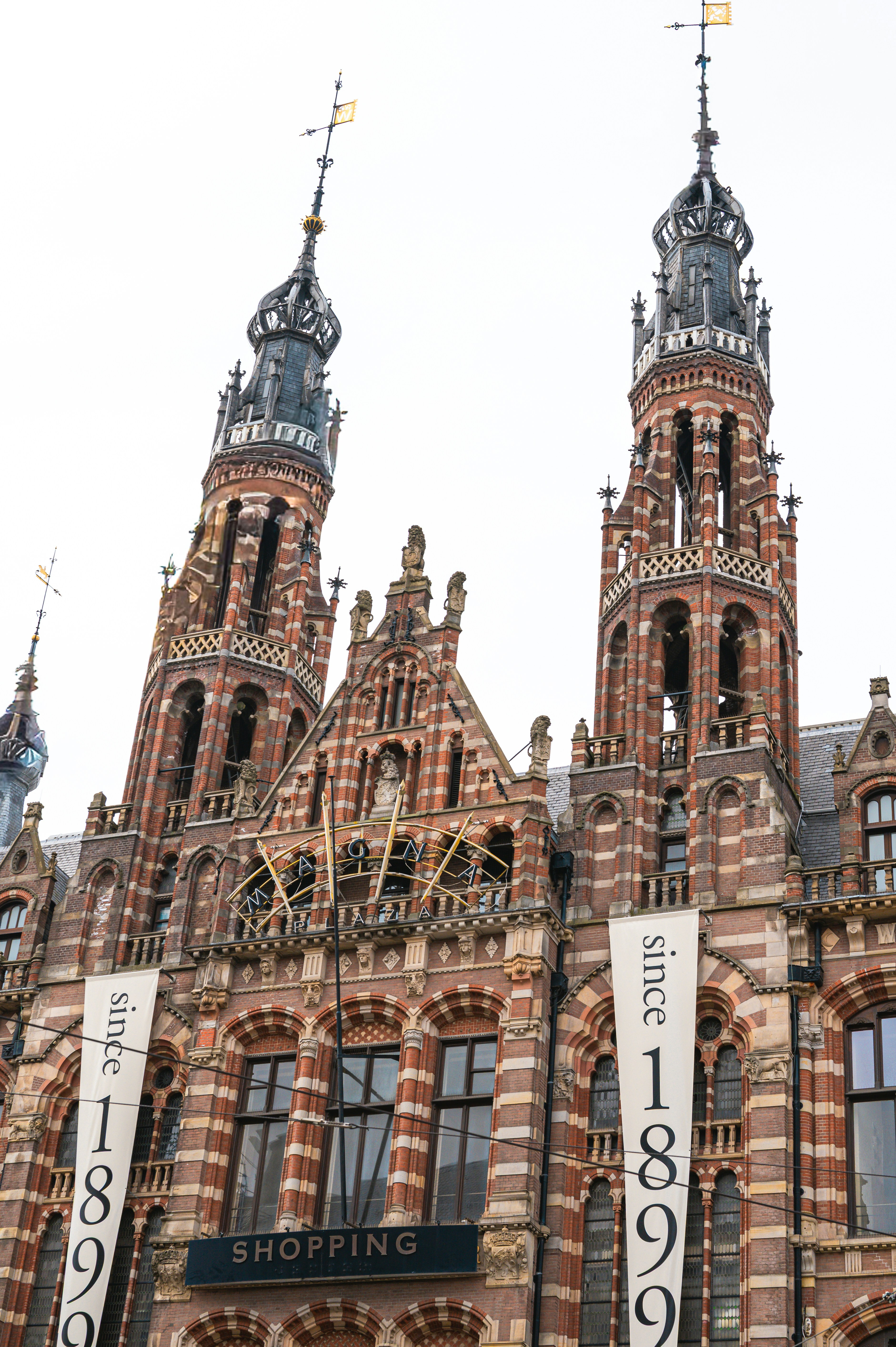 Gothic Facade Dominates a Historic Brick Shopping Hall