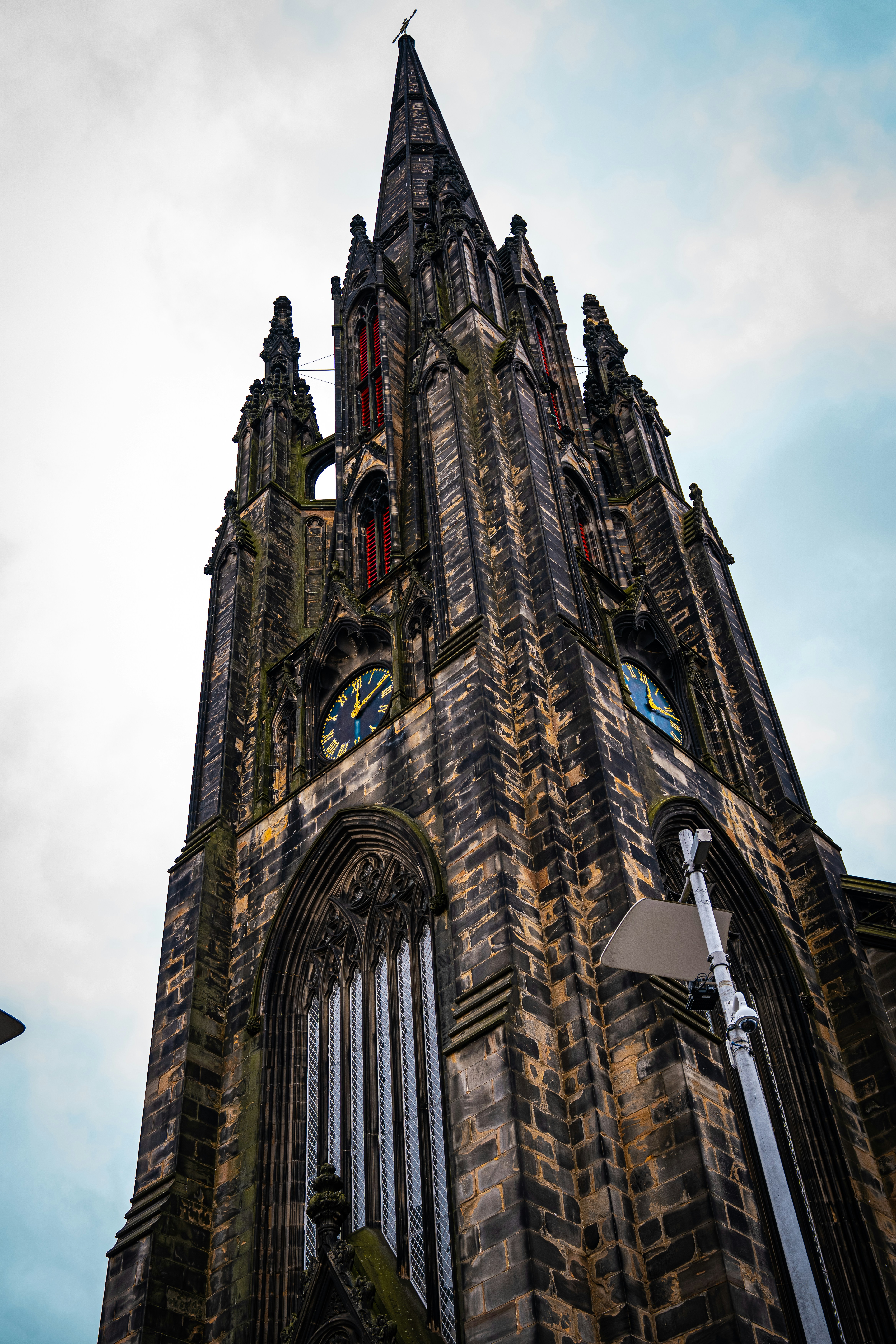 Gothic Spire: Timeworn Facade of a City Clock Tower
