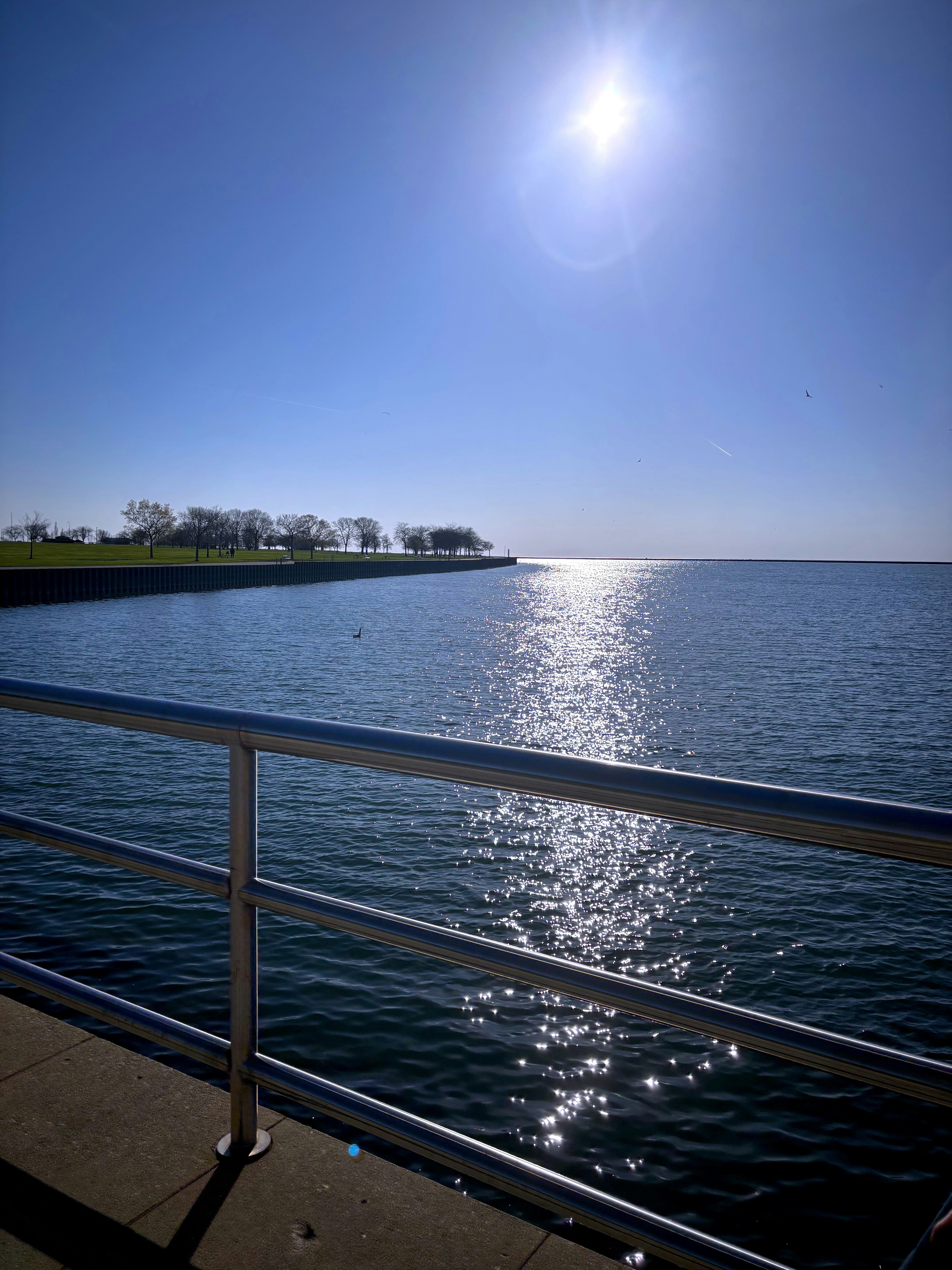 Sunlit Pier Over Calm Waters